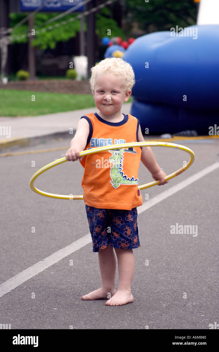 Small blond boy Hula Hooping at local festival in Tennessee Stock Photo ...