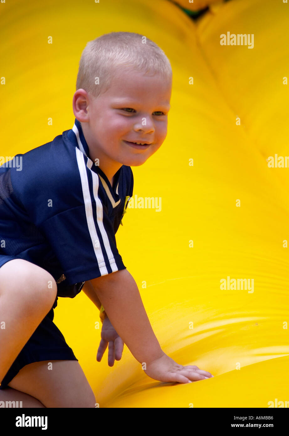 Young boy playing in an inflatable bounce at the East Tennessee ...