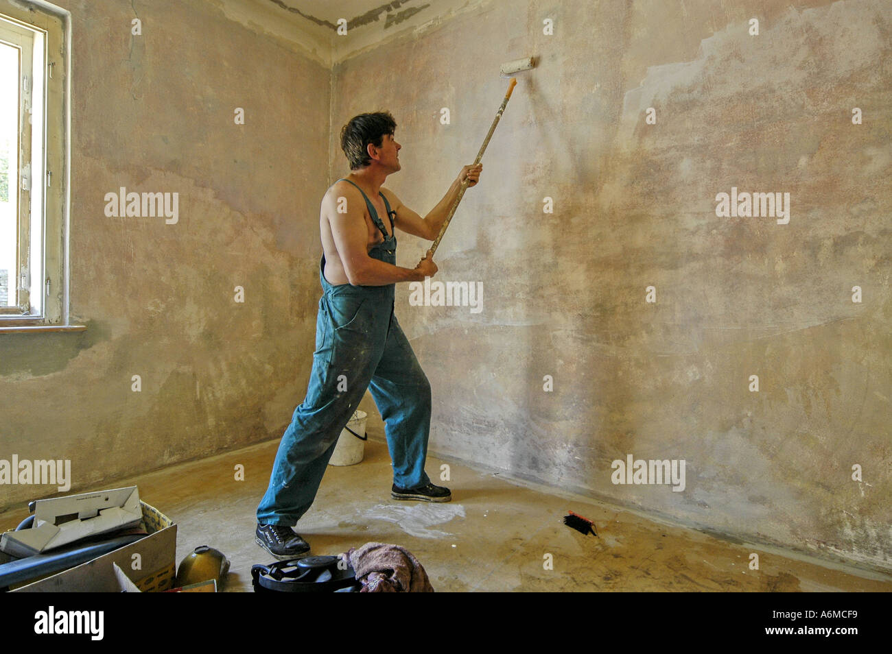 painter worker wall painting Stock Photo - Alamy