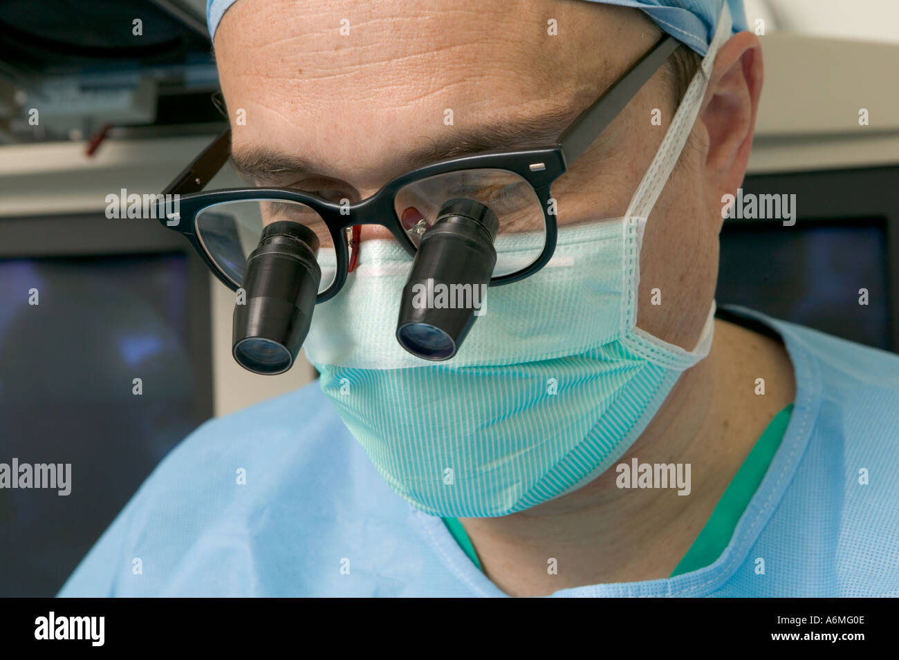 Surgeon wearing surgical magnifying loupes during medical procedure ...