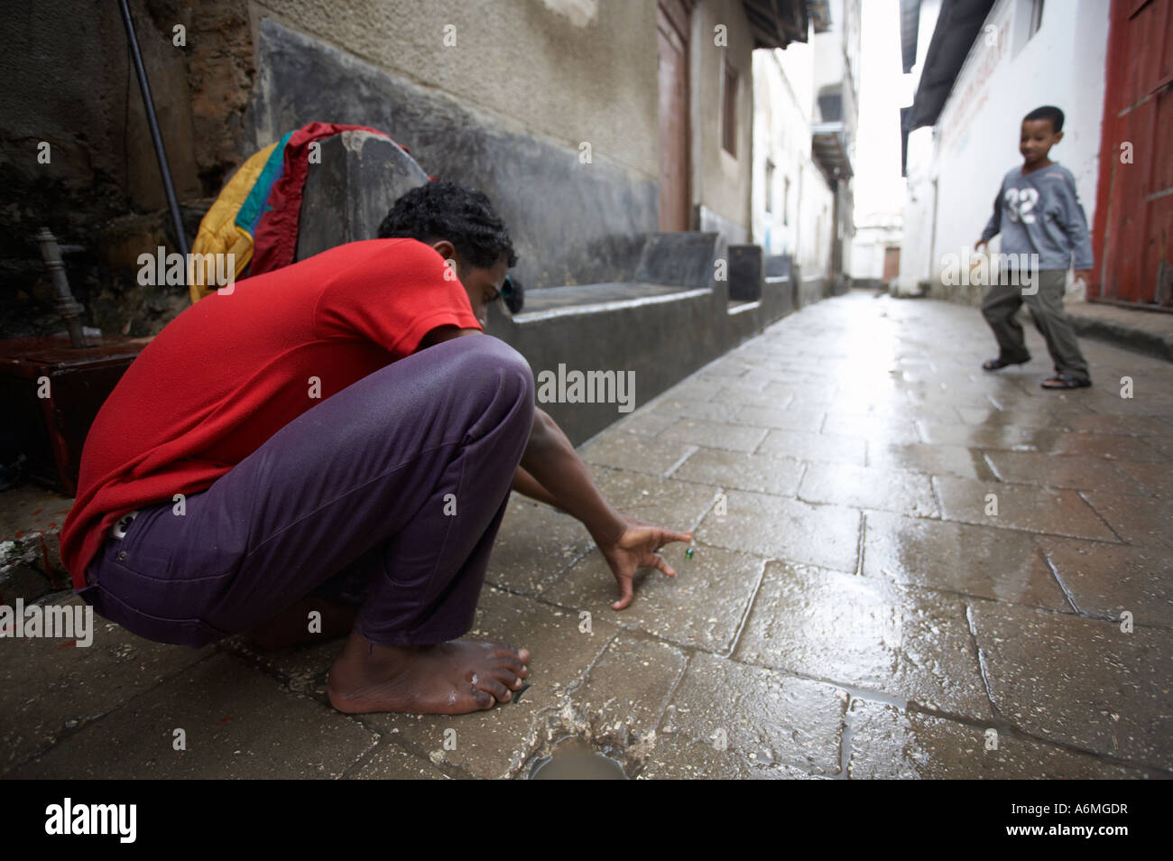Children Playing Marbles, Zanzibar Stock Photo - Alamy