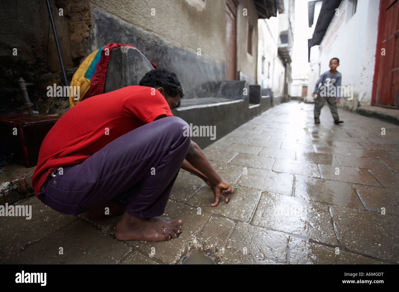 Children Playing Marbles, Zanzibar Stock Photo - Alamy