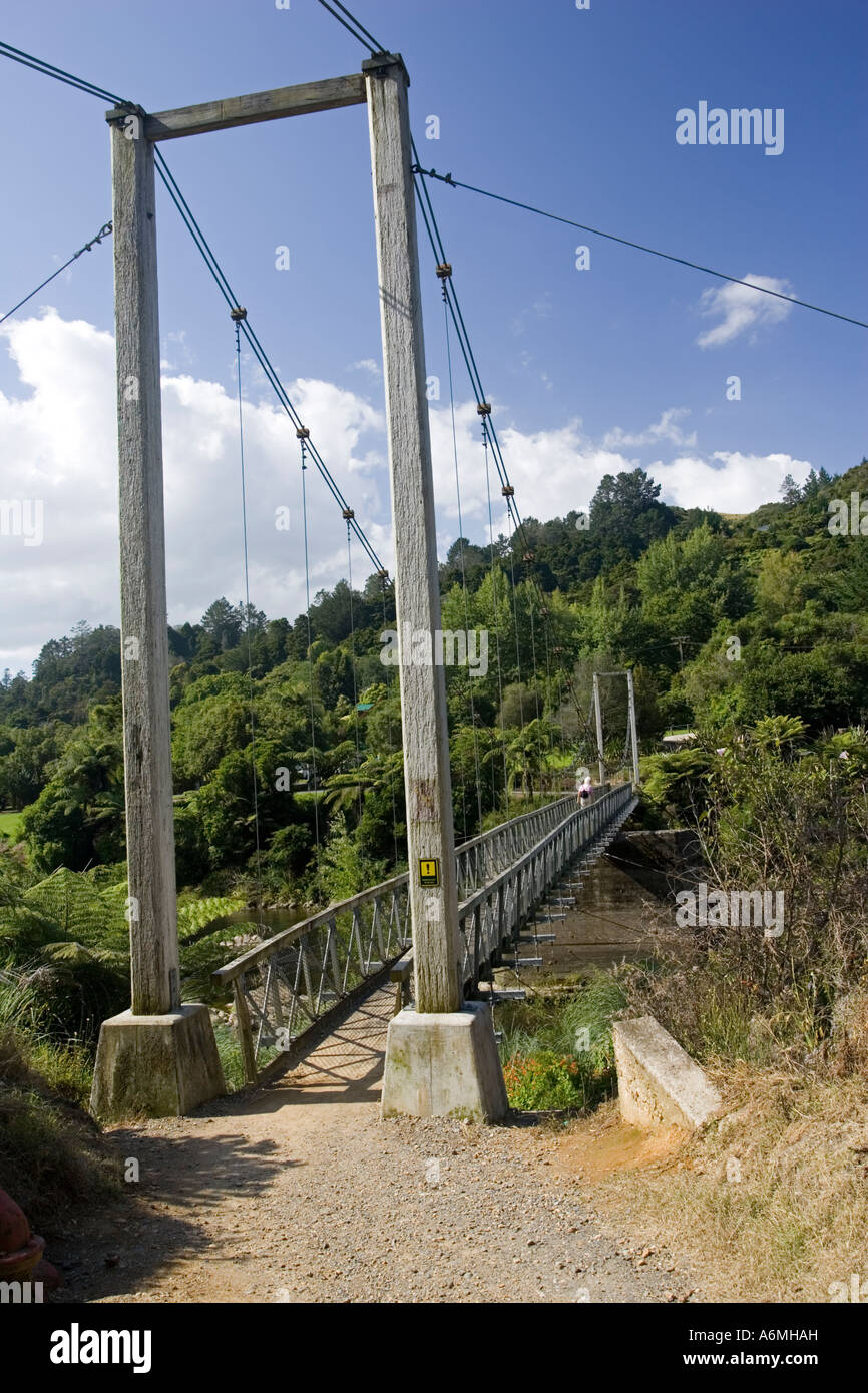 Suspension bridge over Ohinemuri river at entrance to Karangahake Gorge ...