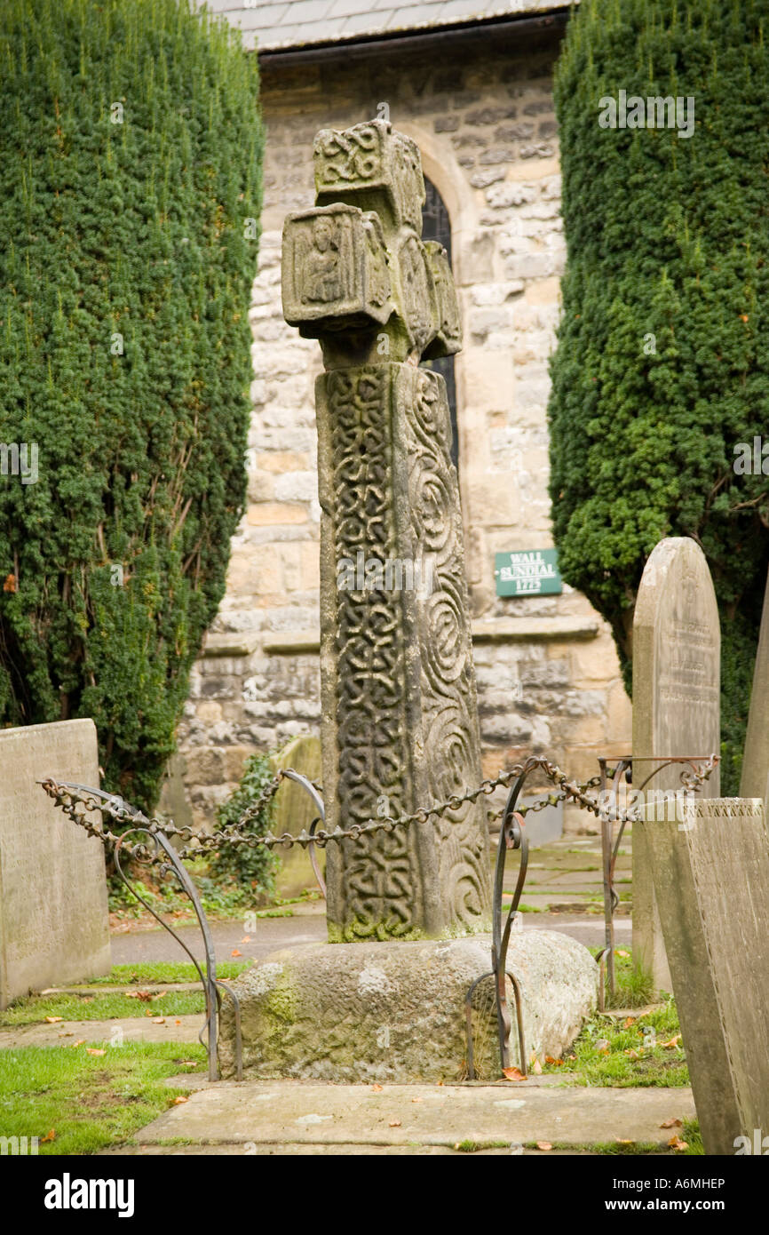 Saxon Cross in the graveyard of the Parish Church of St Lawrence, Eyam ...