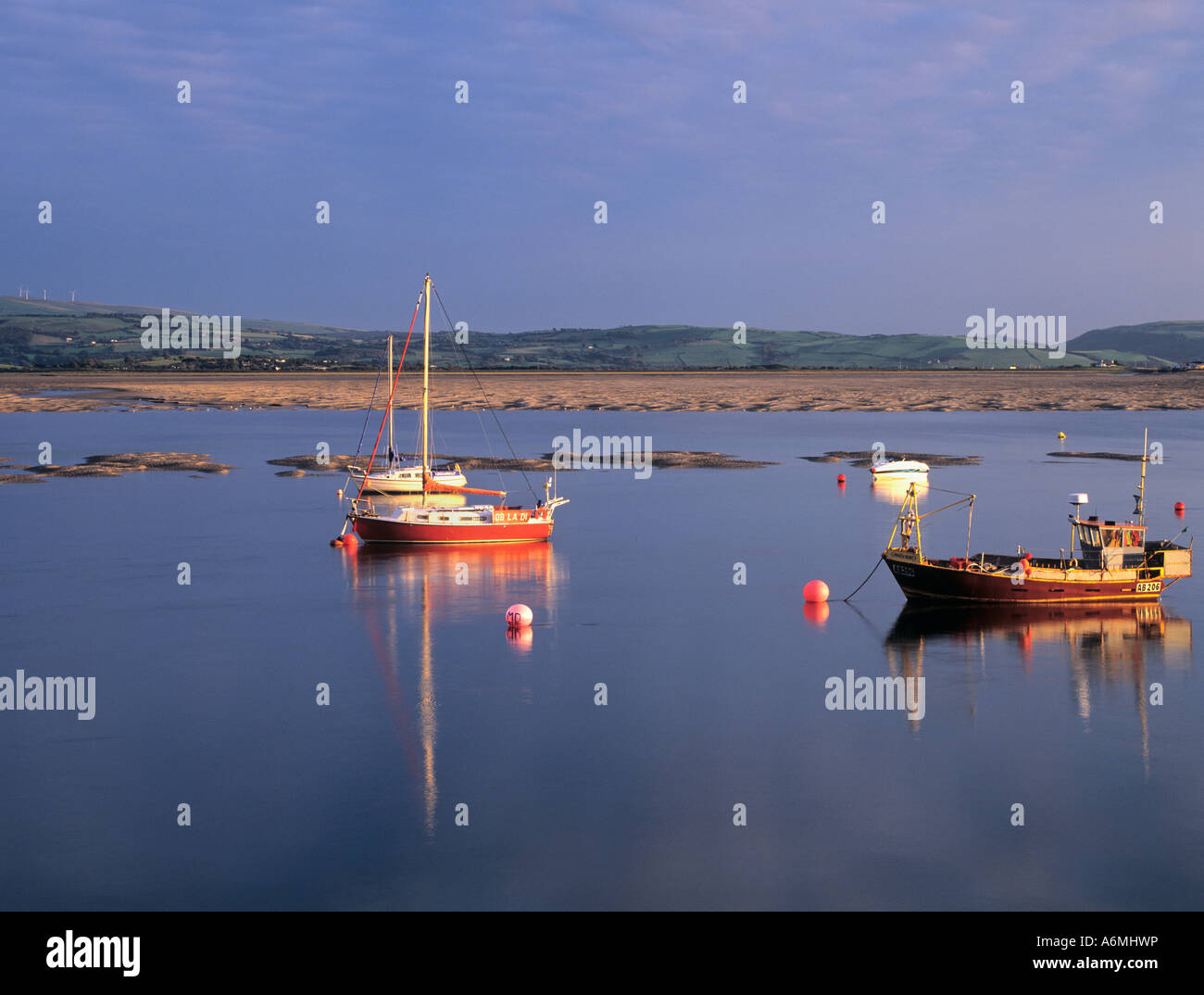 BOATS on River Dovey Afon Dyfi estuary in evening sun at low tide ...