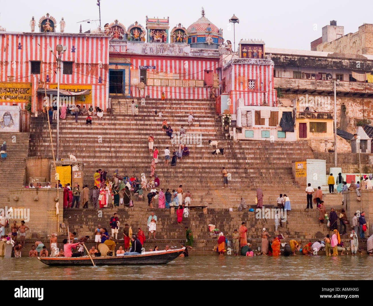 Hindu pilgrims bathing in ganges river on ghat at varanasi hi-res stock ...