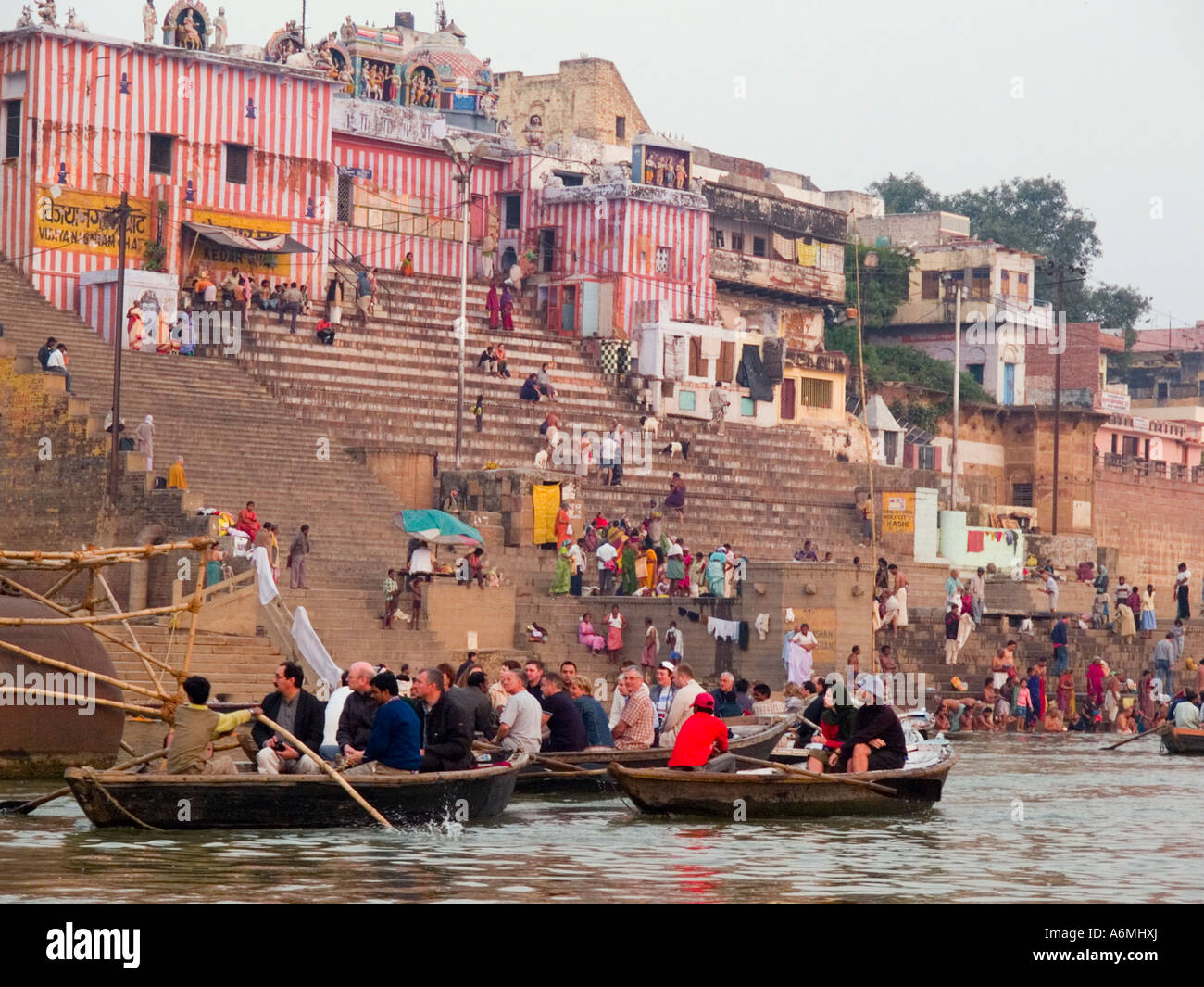 Pilgrims on steps of Kedar Ghat bathing washing in holy waters of River ...