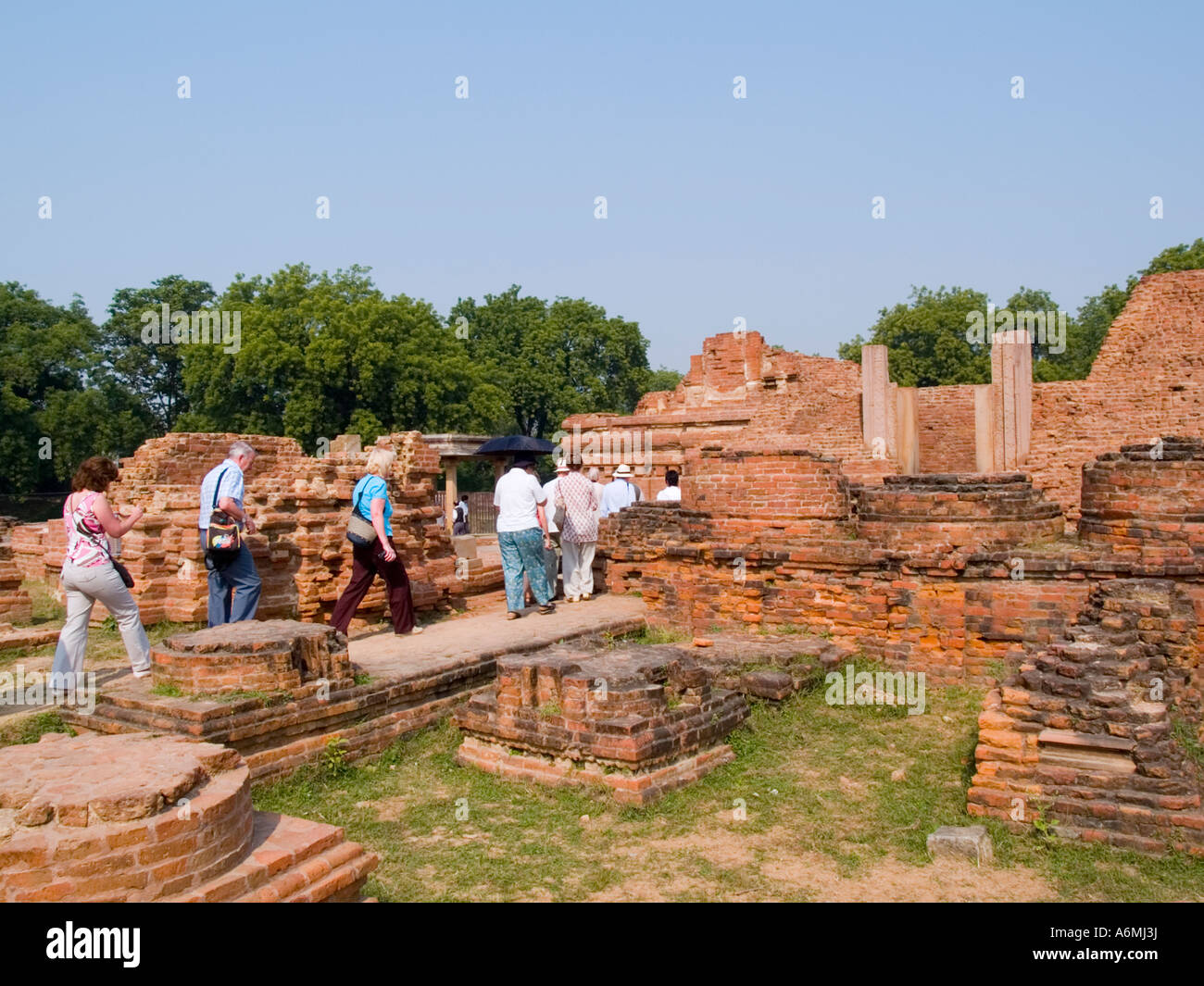 Western tourist group at Dharmarajika Stupa remains in "Isipatana Deer ...