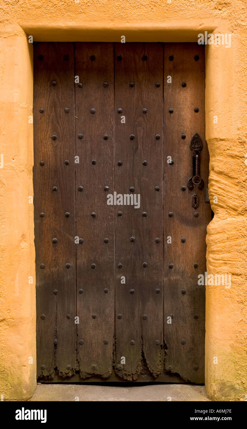 Medieval studded wooden front door Stock Photo - Alamy