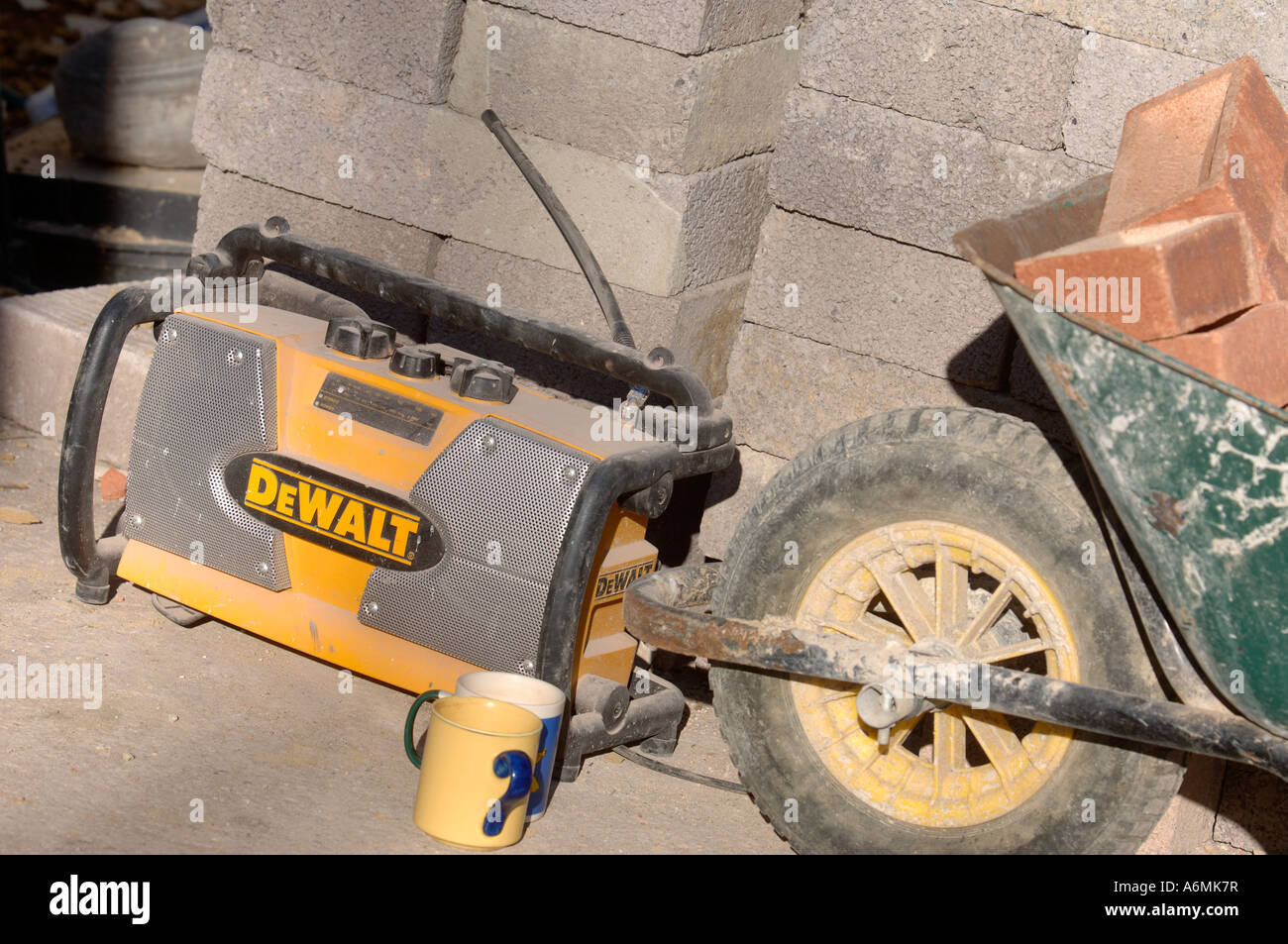 A DEWALT BUILDERS RADIO ALONGSIDE A STACK OF CONCRETE BLOCKS RENOVATION ...