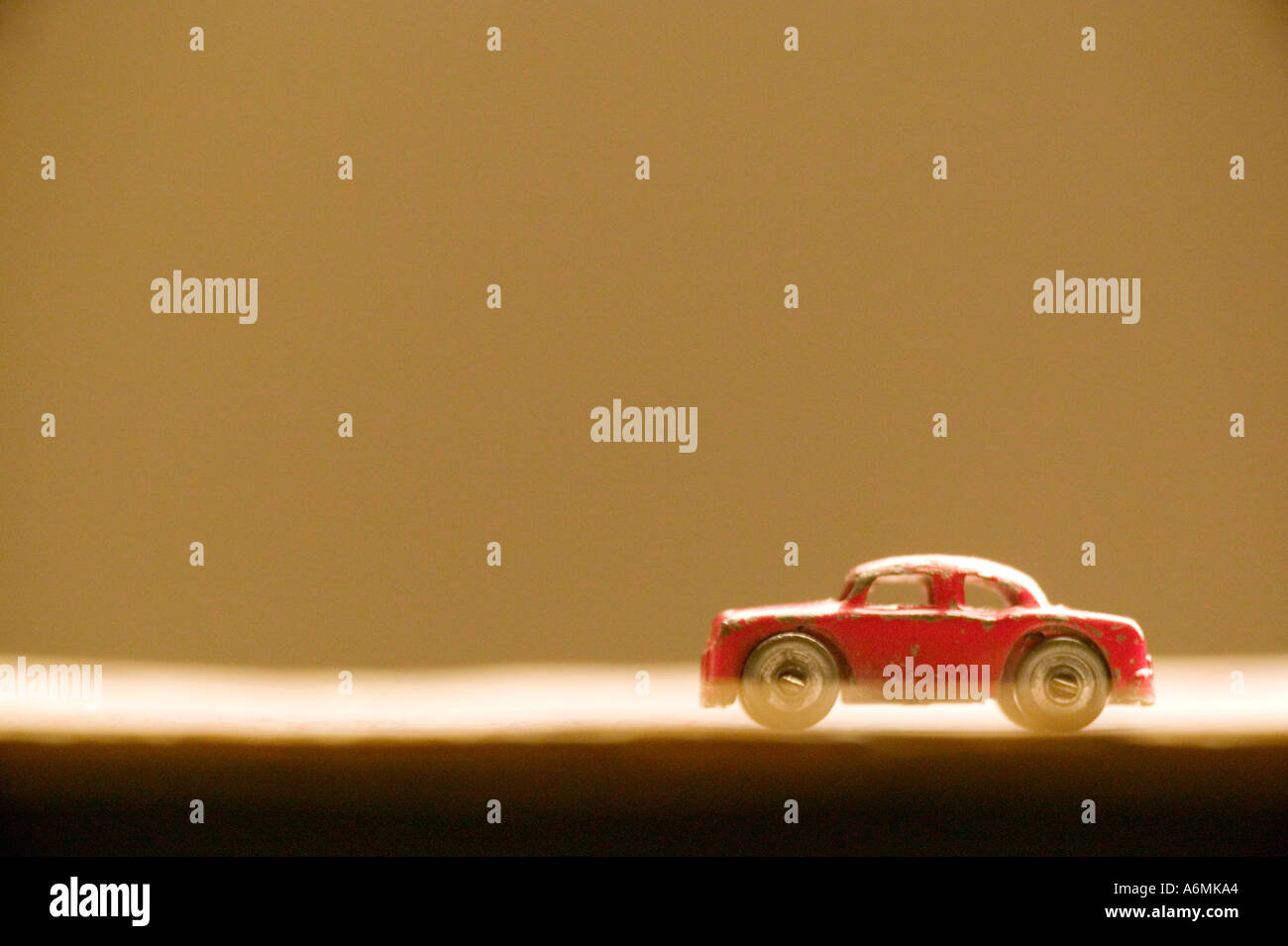 Red toy card on imaginary road Stock Photo - Alamy