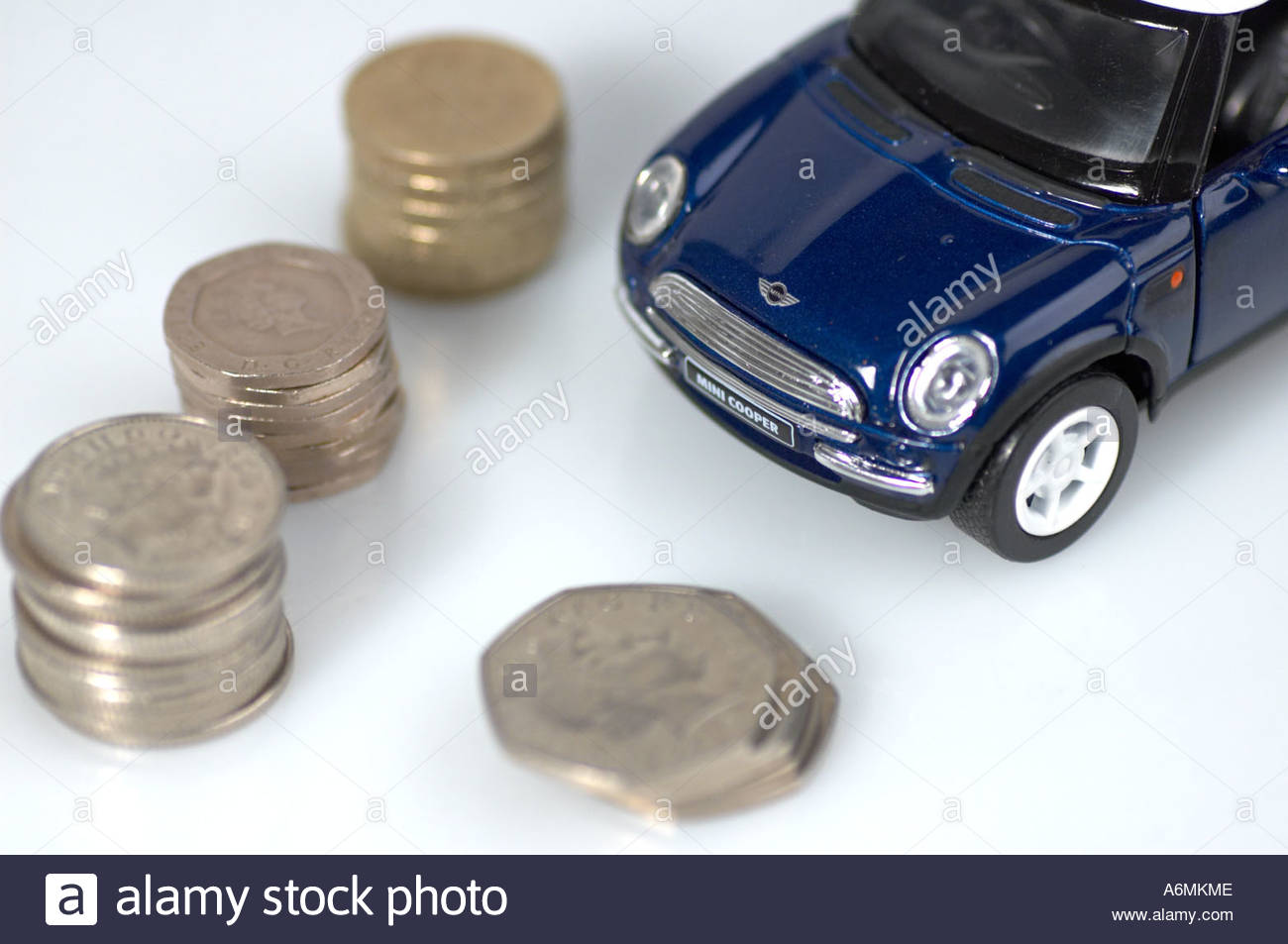 Toy car on coin hi-res stock photography and images - Alamy