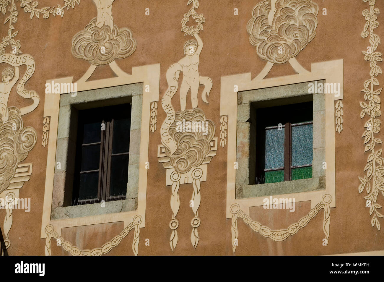 Two windows in ornate wall of building, Placa de Pi El Barri Gotic ...