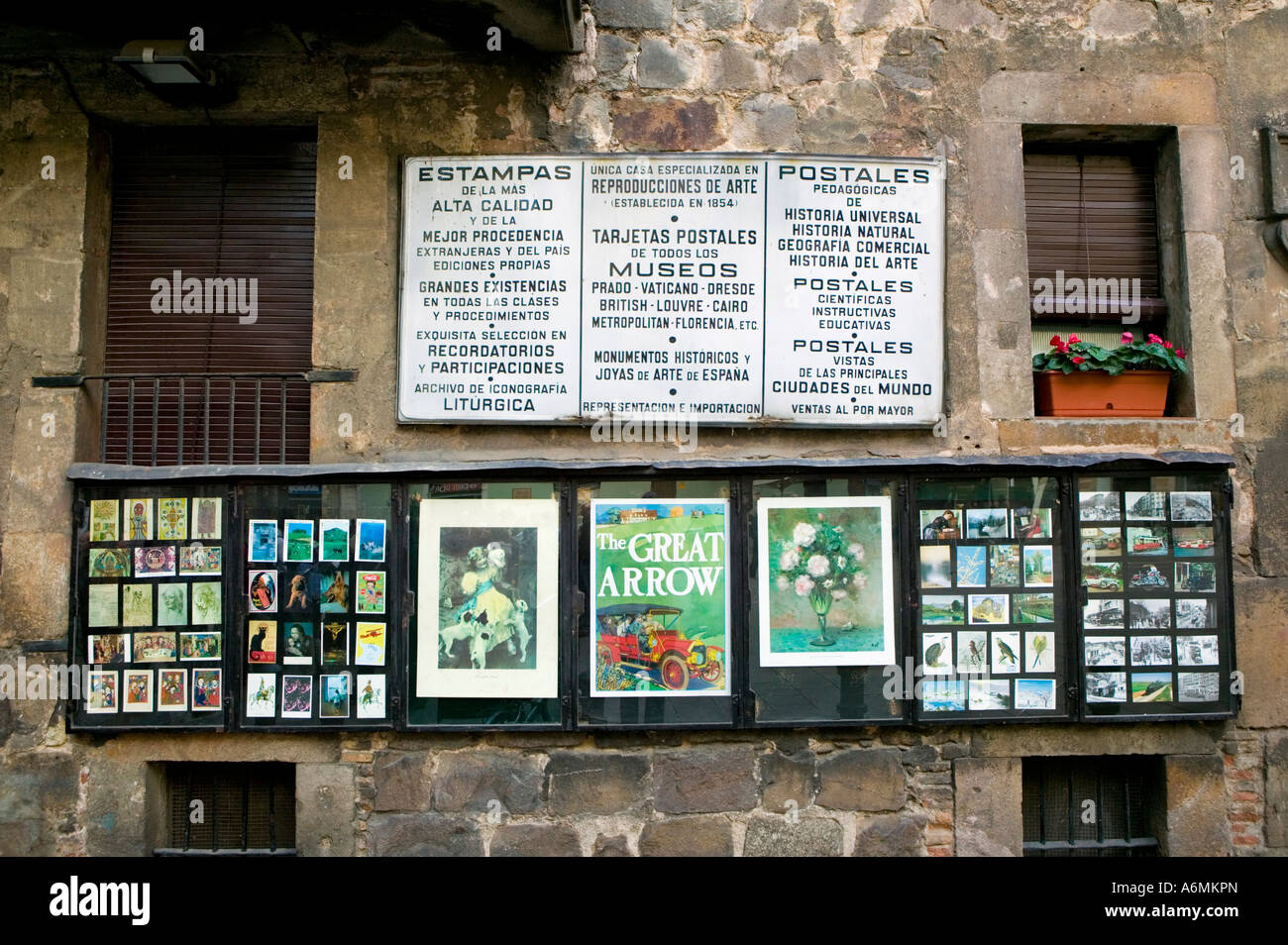 Signs and display on wall outside stamp shop Placa de Pi El Barri Gotic ...