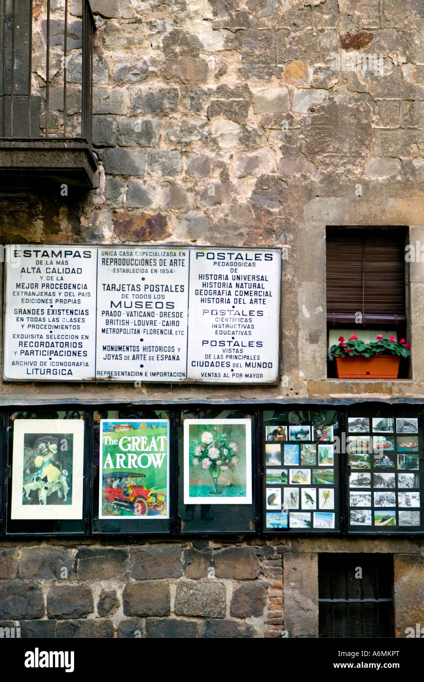 Signs and display on wall outside stamp shop Placa de Pi El Barri Gotic ...