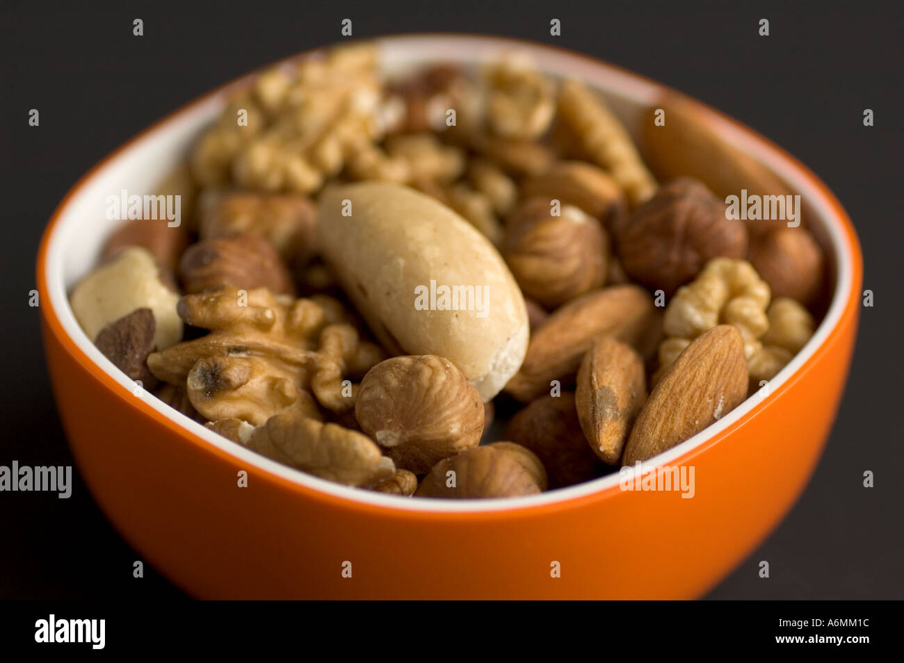 Mixed brazil hazel walnut nuts in a bowl Stock Photo - Alamy