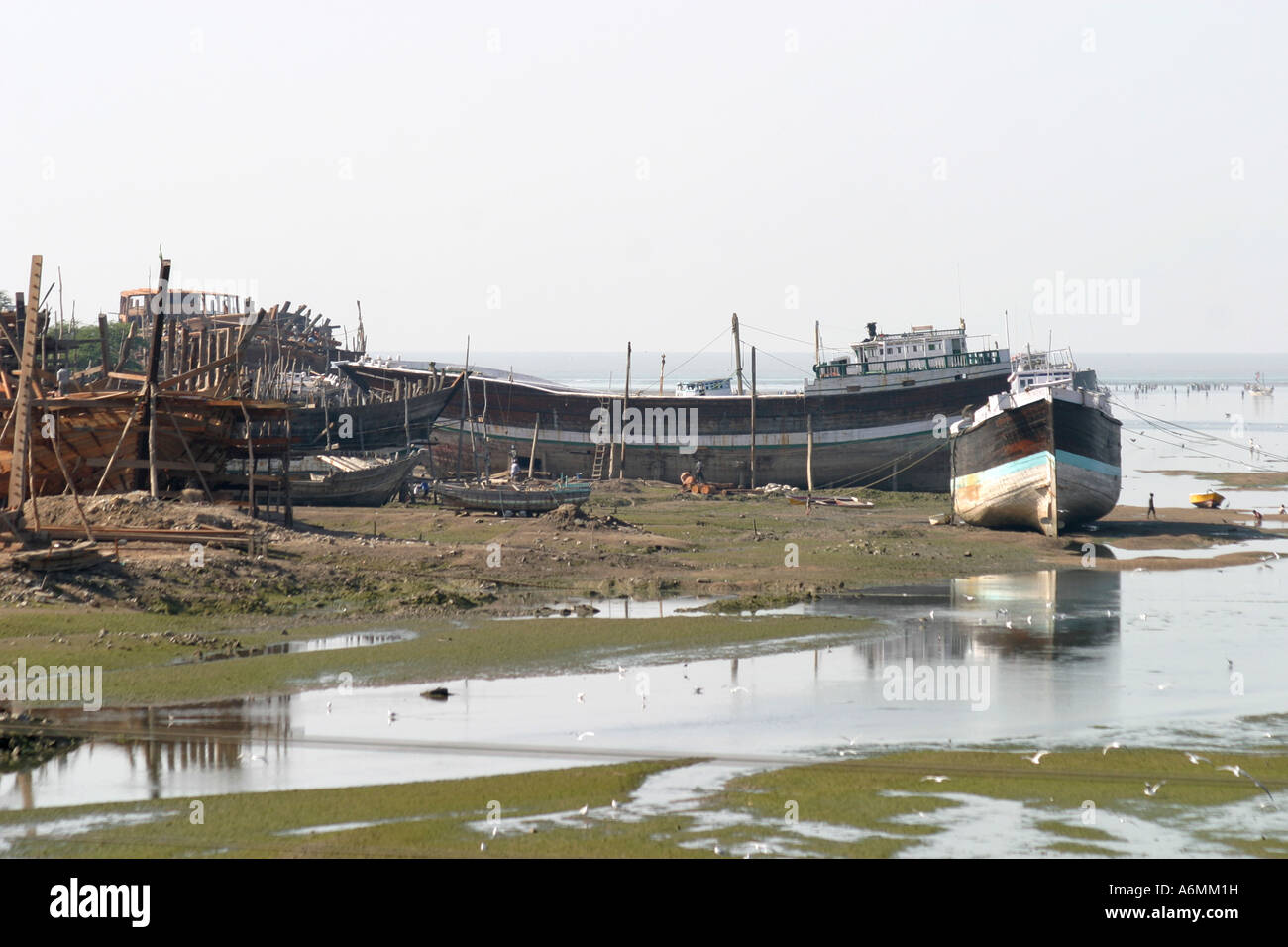 Boat building and fishing on the Rukmavati River,Mandvi Port in the ...