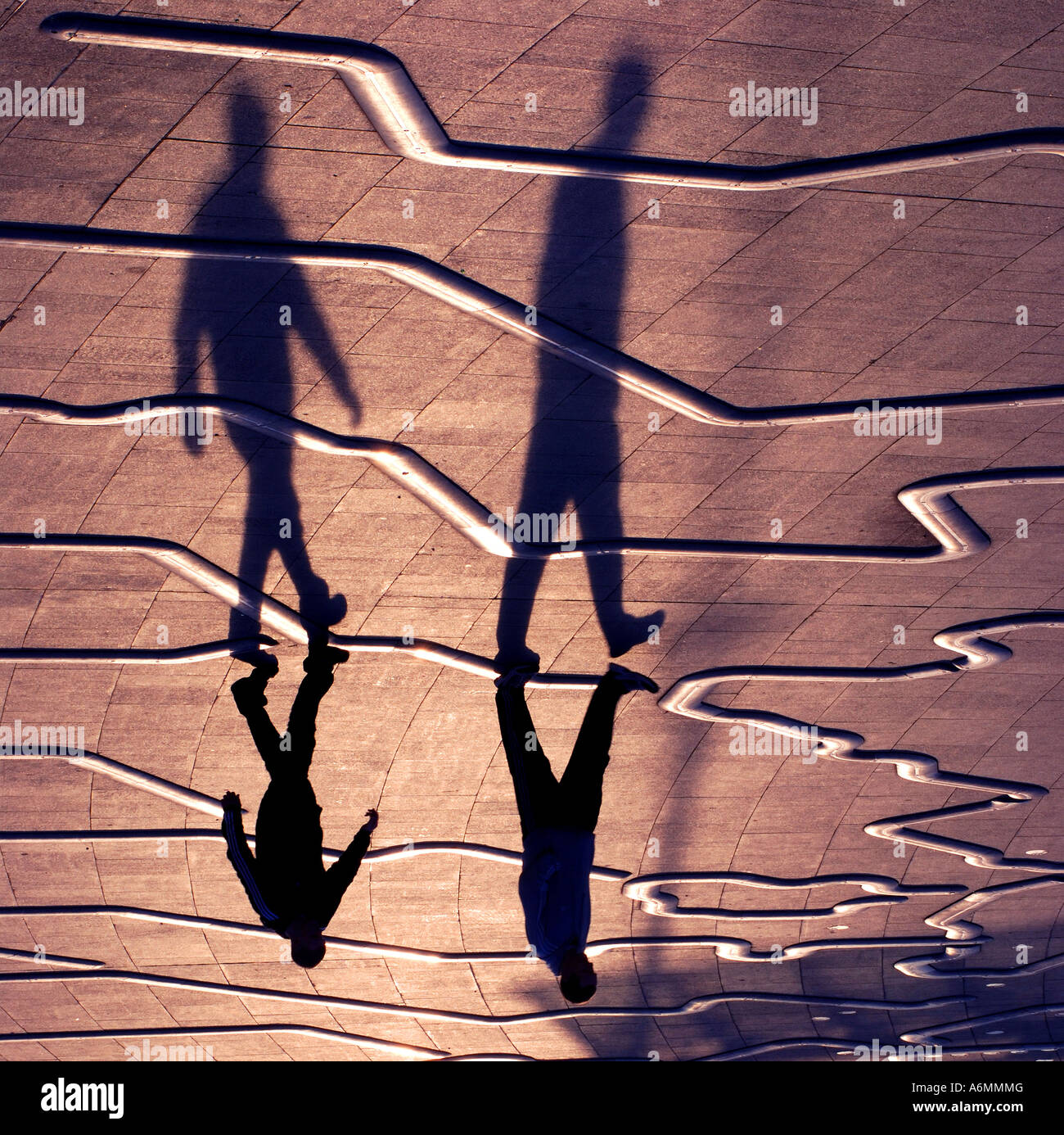 Shadows of two men walking Stock Photo - Alamy