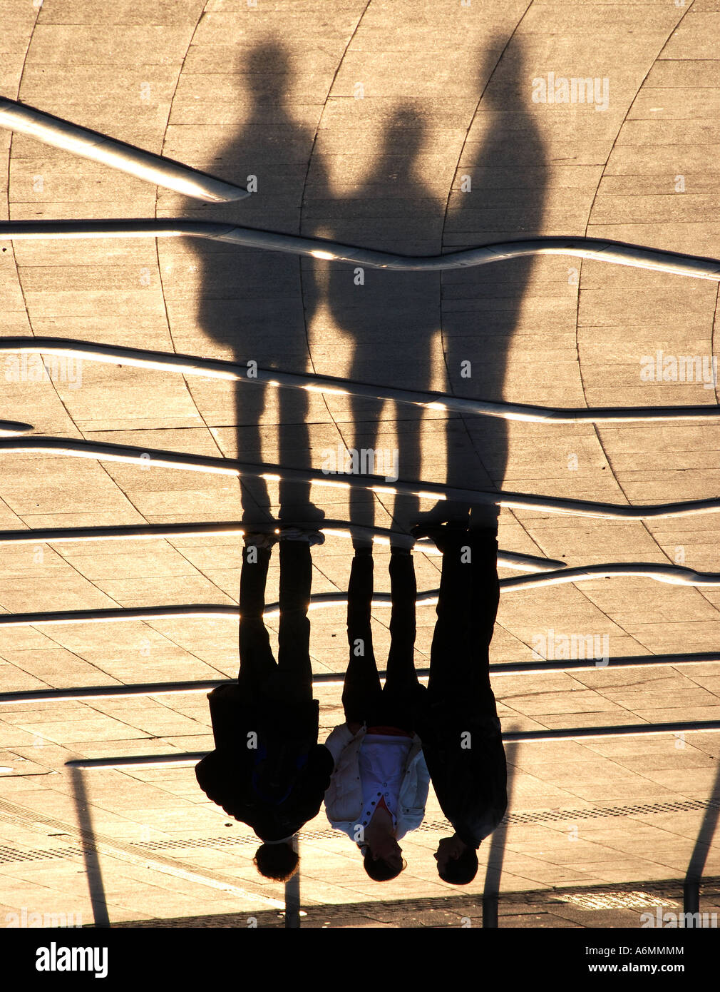Shadows of three people Stock Photo - Alamy