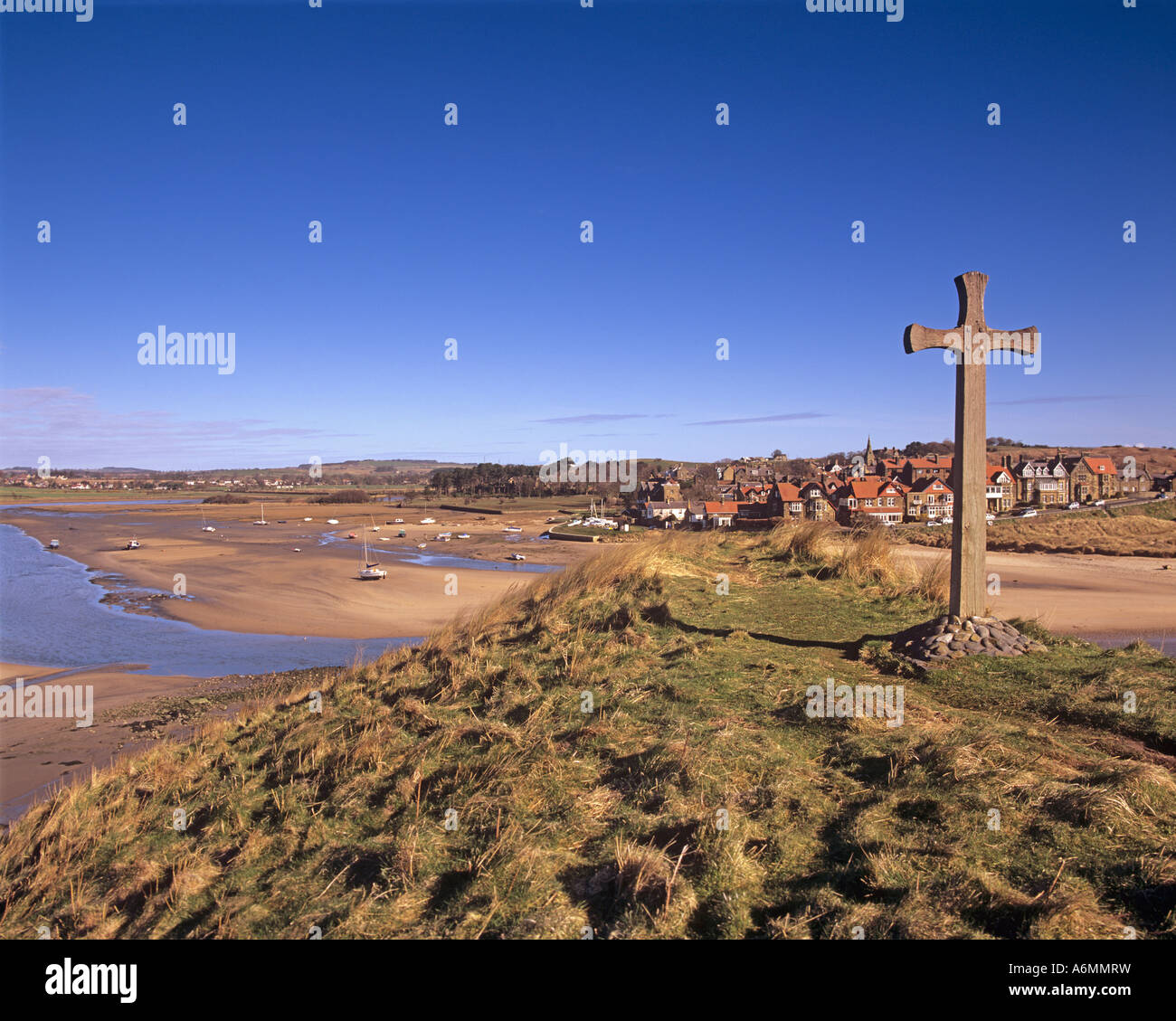 St Cuthberts Cross overlooks the estuary of the River Aln and the ...