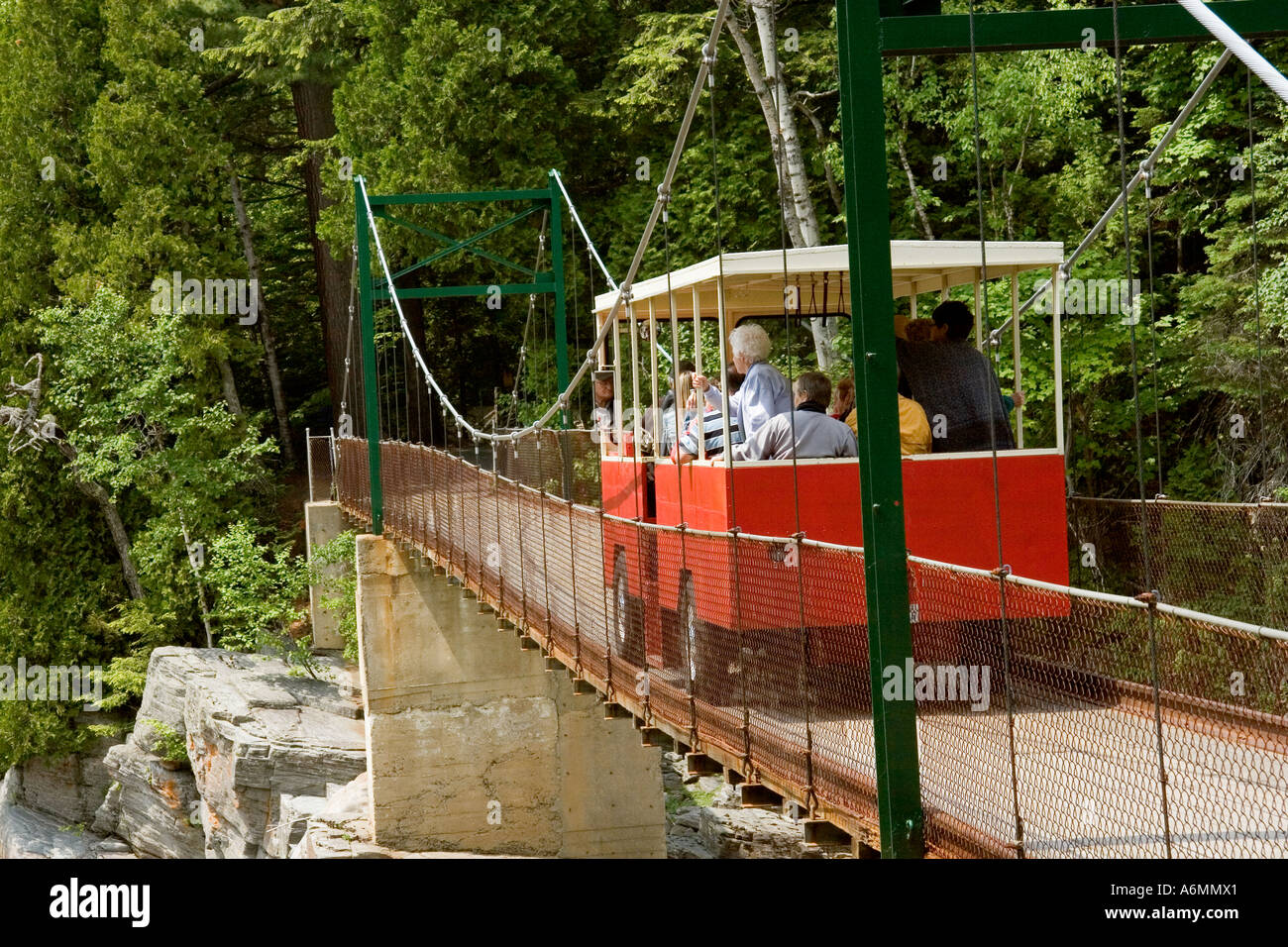 Shuttle bus carries visitors across bridge at the canyon of Ste-Anne ...