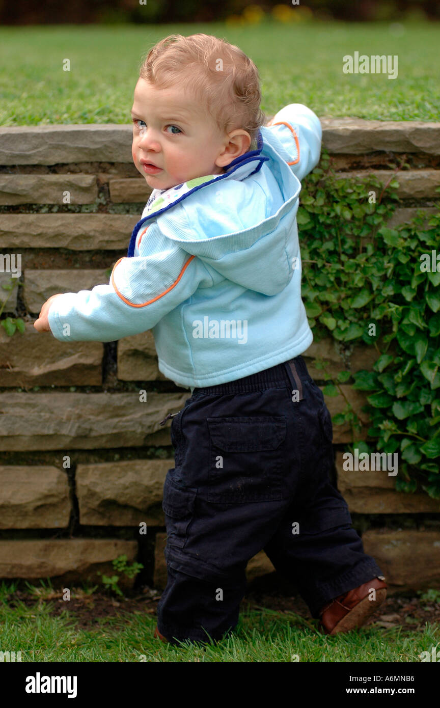 9 month old Boy trying to stand Stock Photo - Alamy