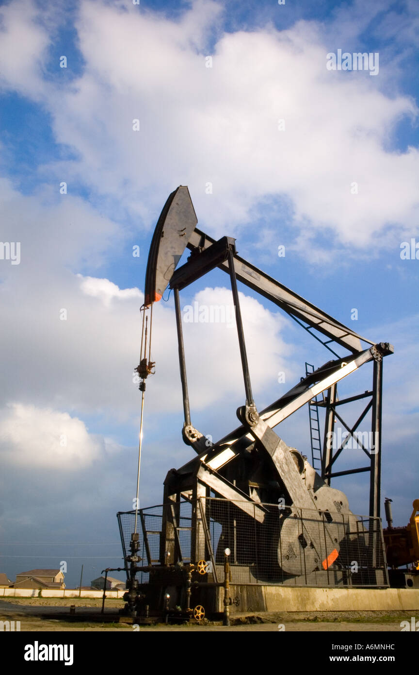 oil pumping unit with cloudy skies Stock Photo - Alamy