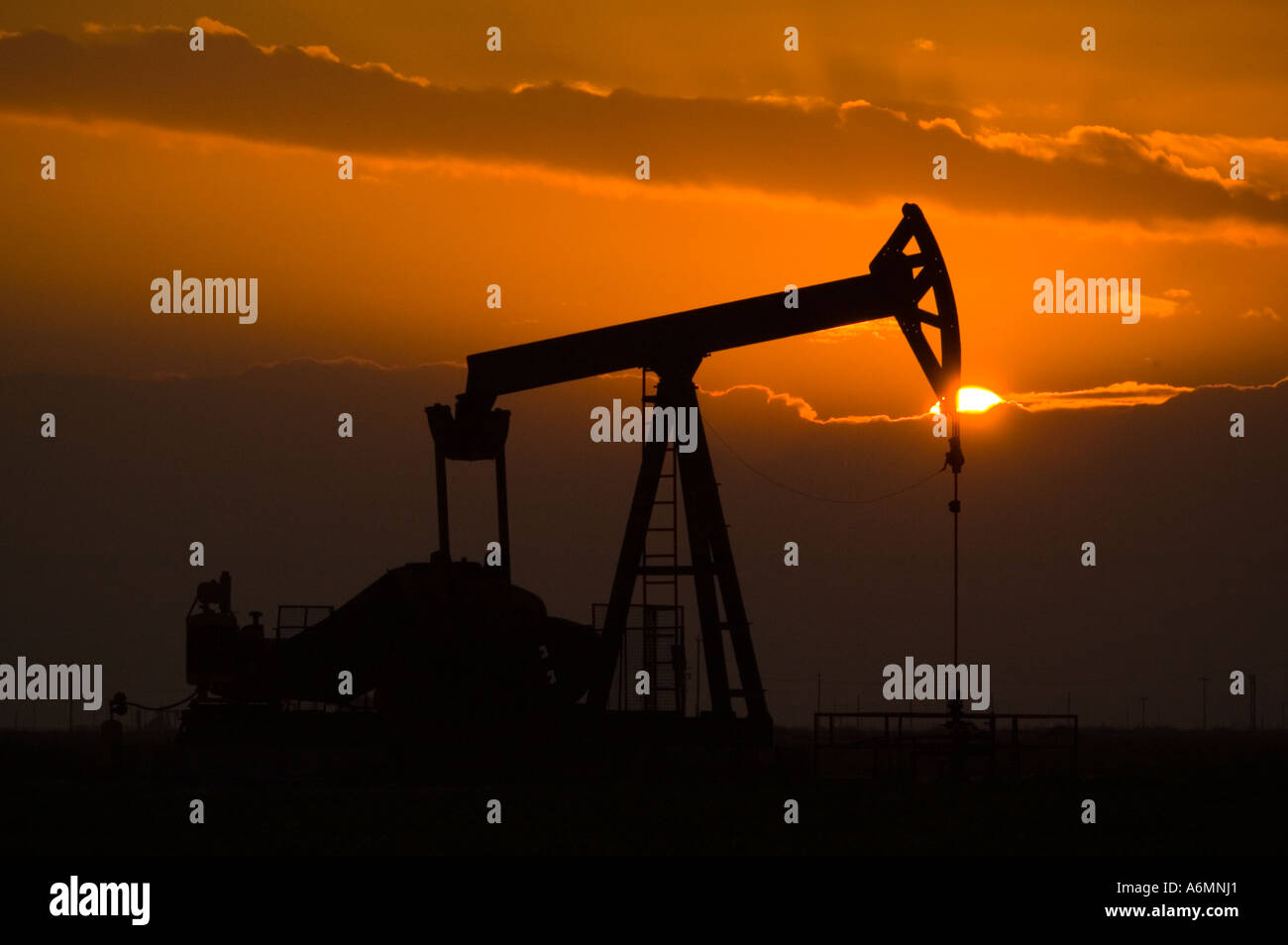 oil pumping unit at sunset Stock Photo - Alamy