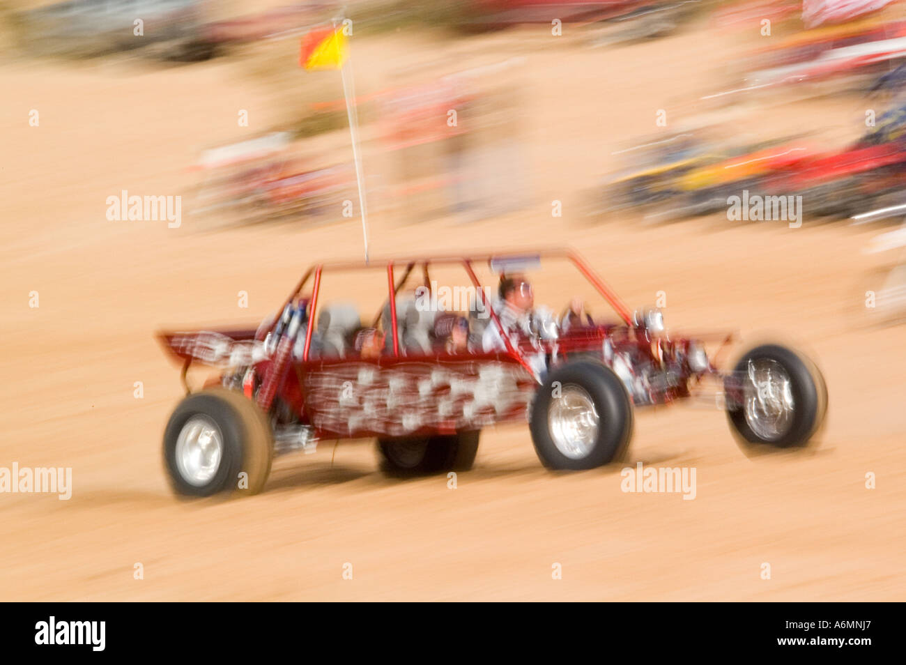 red sand car driving in the sand dunes Stock Photo - Alamy