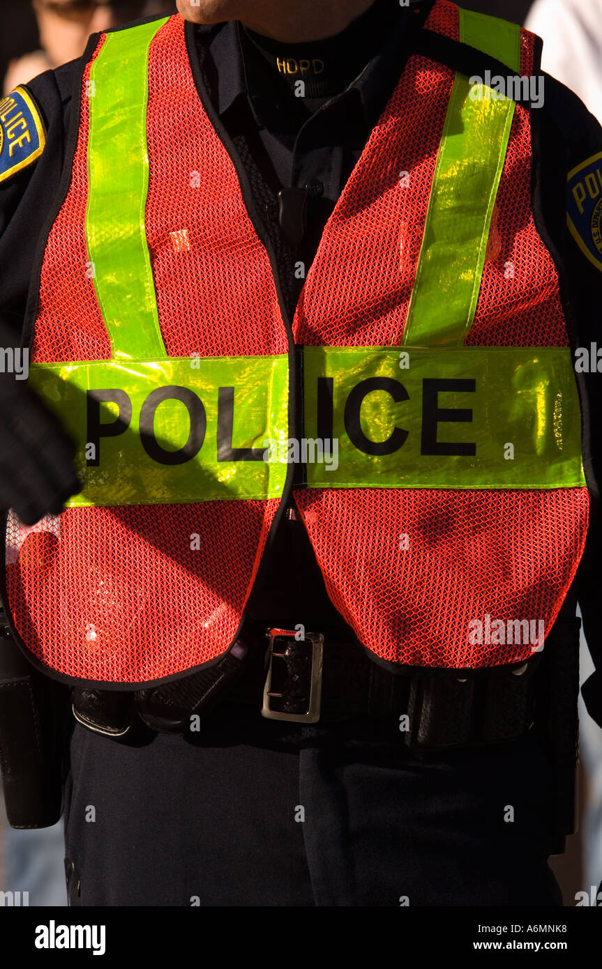 police person with bright orange vest Stock Photo - Alamy