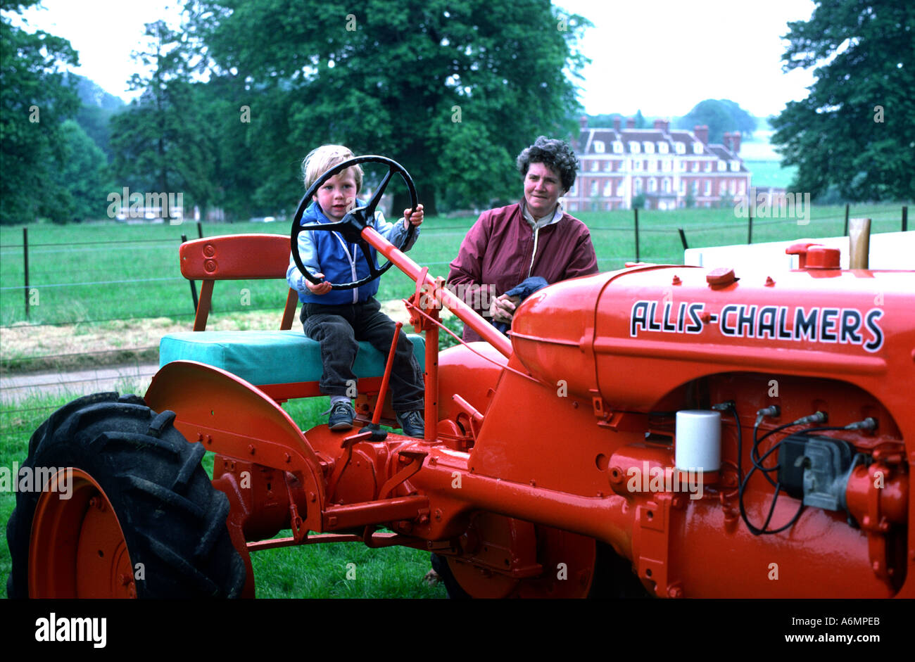 Small boy in red tractor Stock Photo - Alamy