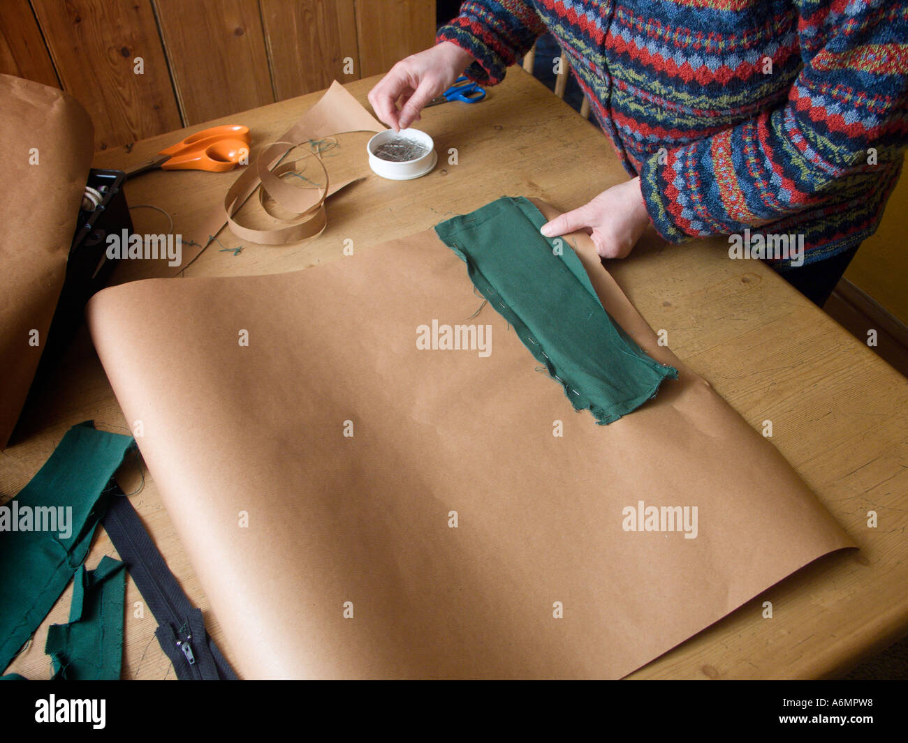 Making a pattern template out of brown paper Stock Photo - Alamy