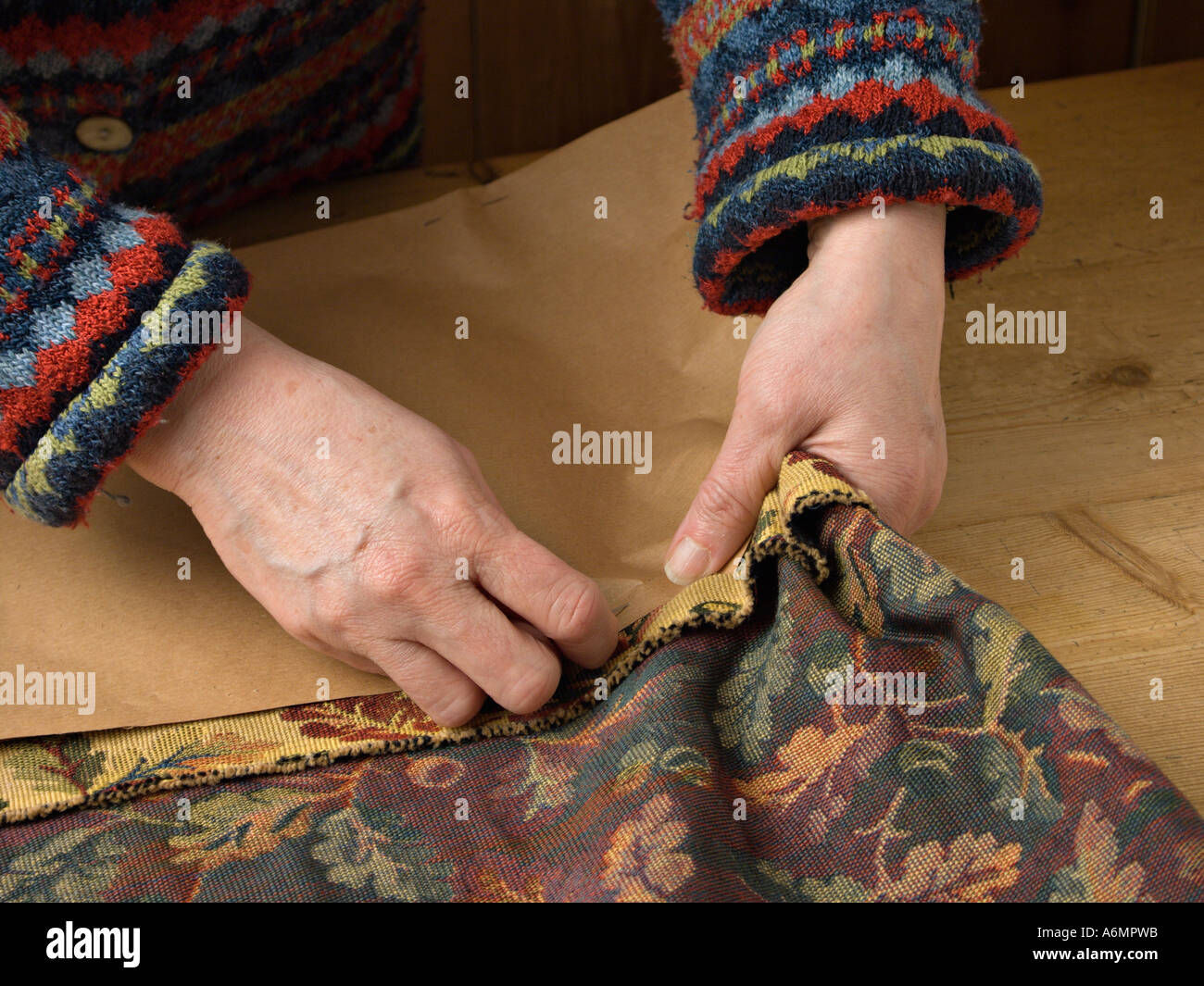 Making a pattern template out of brown paper Stock Photo - Alamy