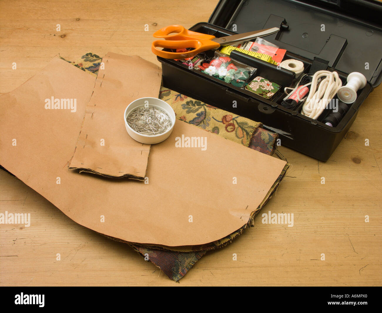 Making a pattern template out of brown paper Stock Photo - Alamy