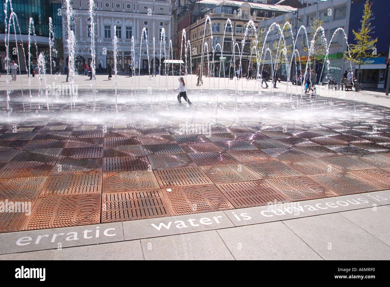 young girl running through street fountain in liverpool UK Stock Photo ...