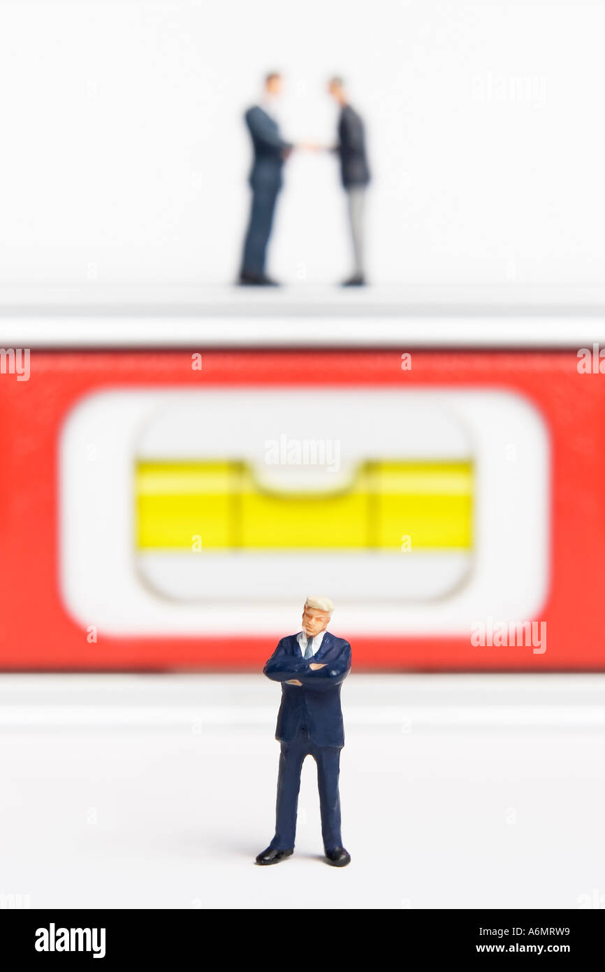 Business figures and a level Stock Photo - Alamy