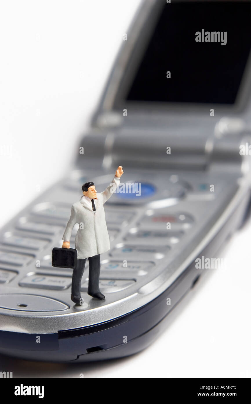 Business figure and portable phone Stock Photo - Alamy