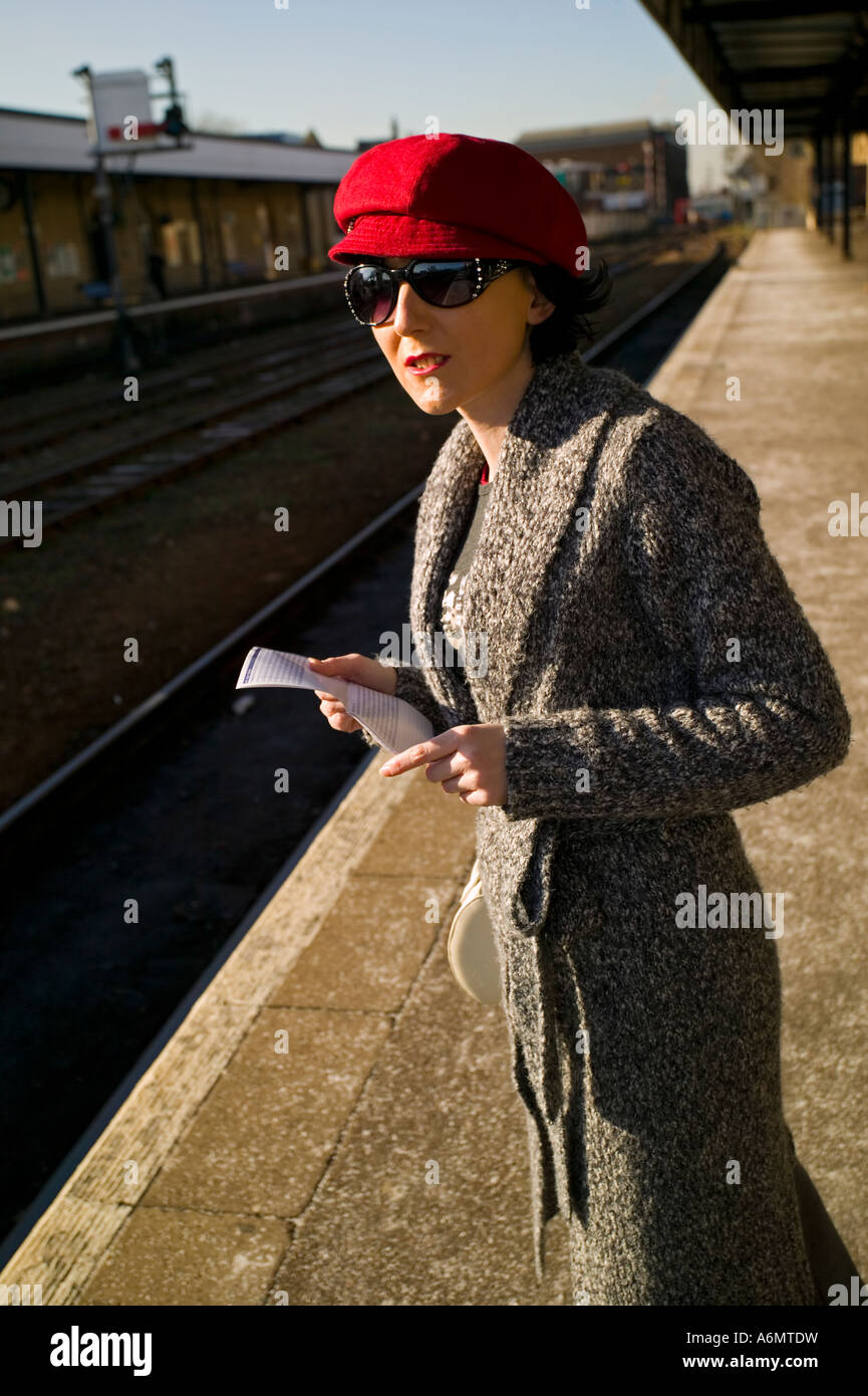 woman at a railway station Stock Photo - Alamy
