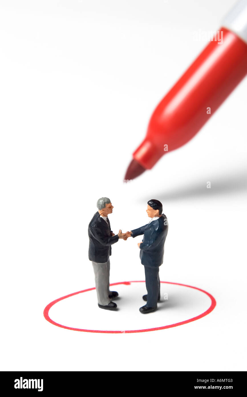 Business figures shaking hands Stock Photo - Alamy
