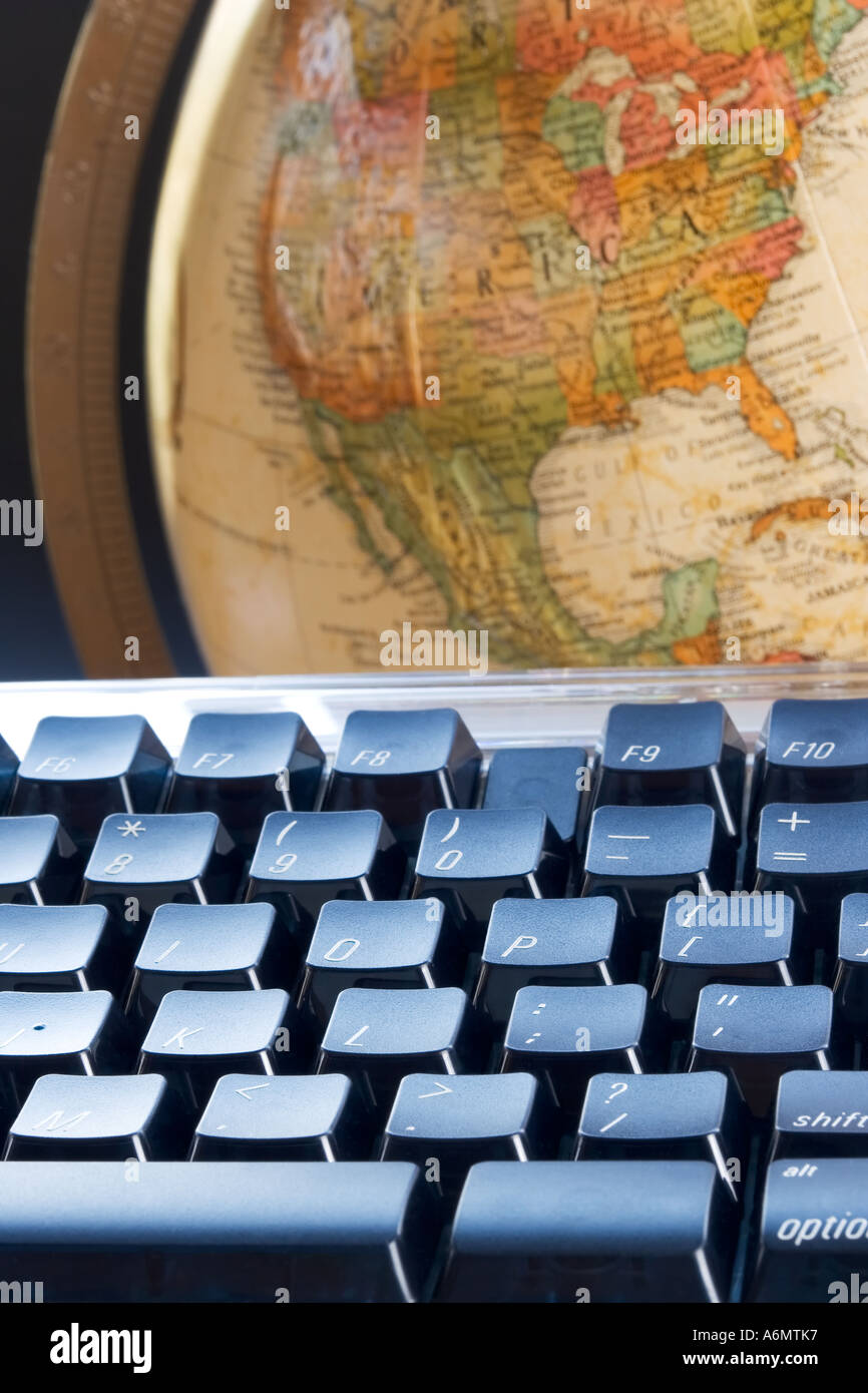 Earth globe and computer keyboard Stock Photo - Alamy