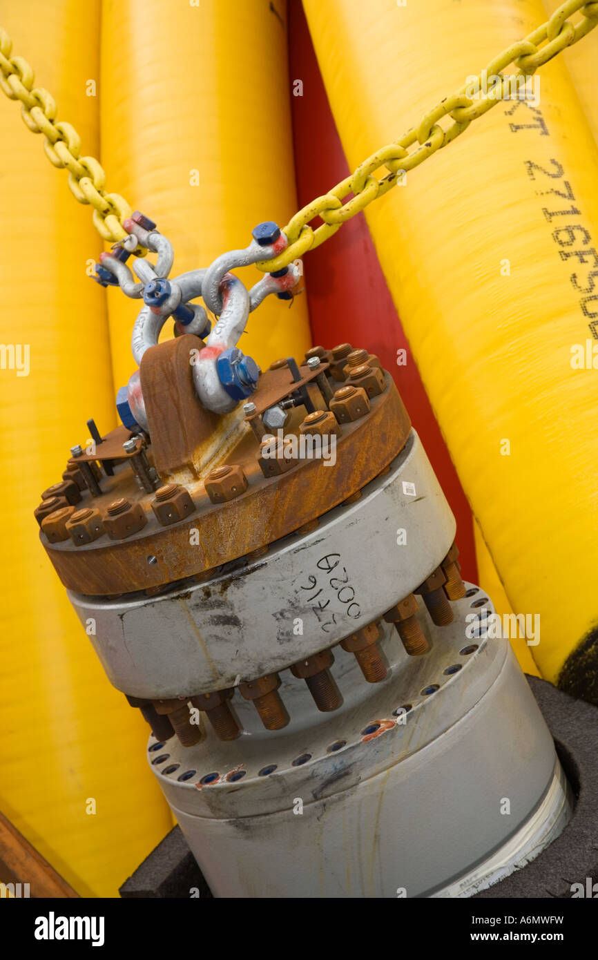 Old rig pipeline shackles and chains on giant pipe laying wheel ...