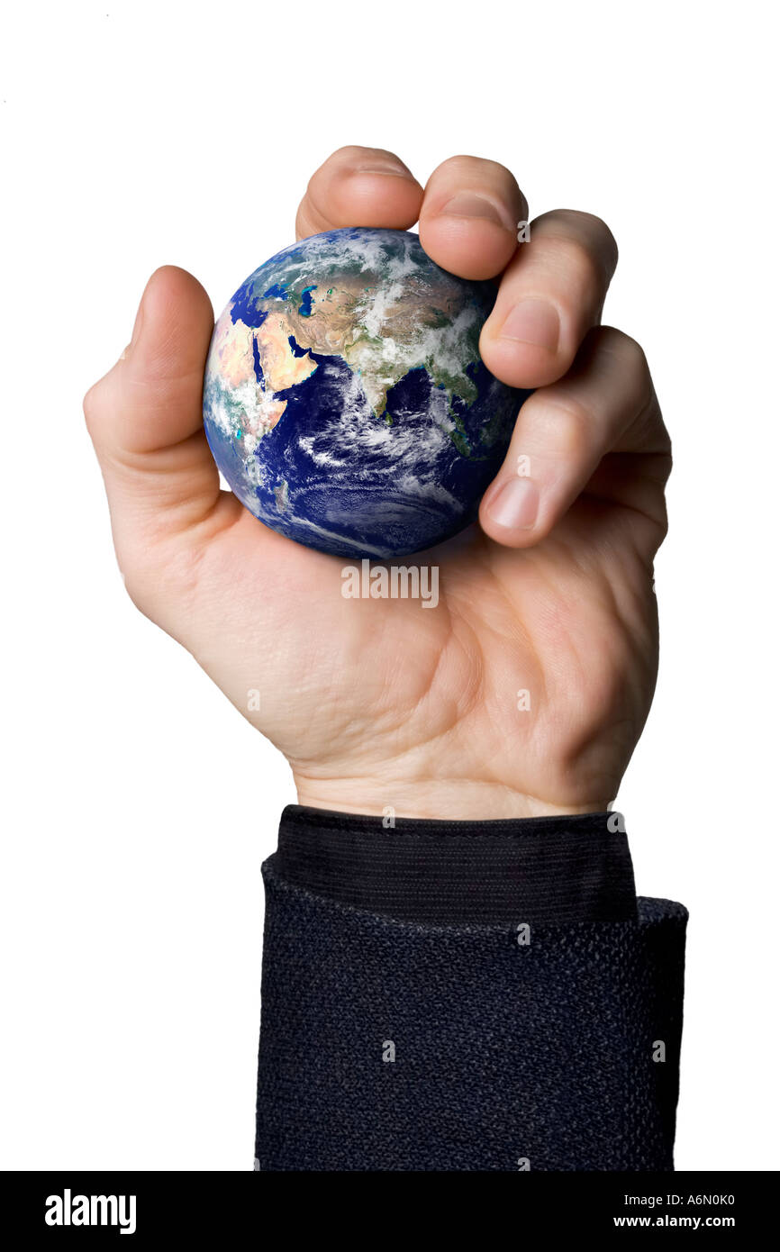 Hand grasping earth Stock Photo - Alamy