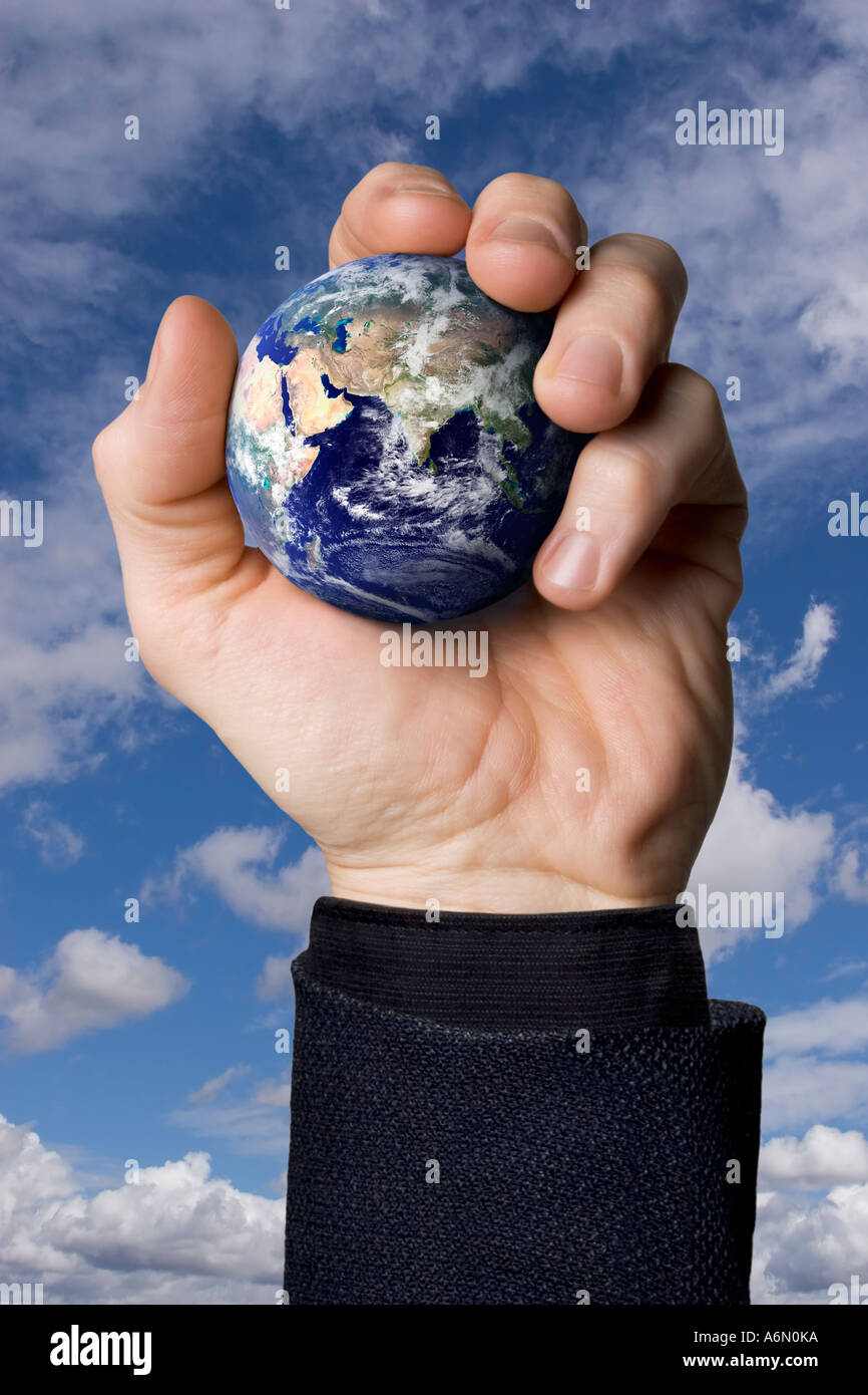 Hand grasping earth hi-res stock photography and images - Alamy
