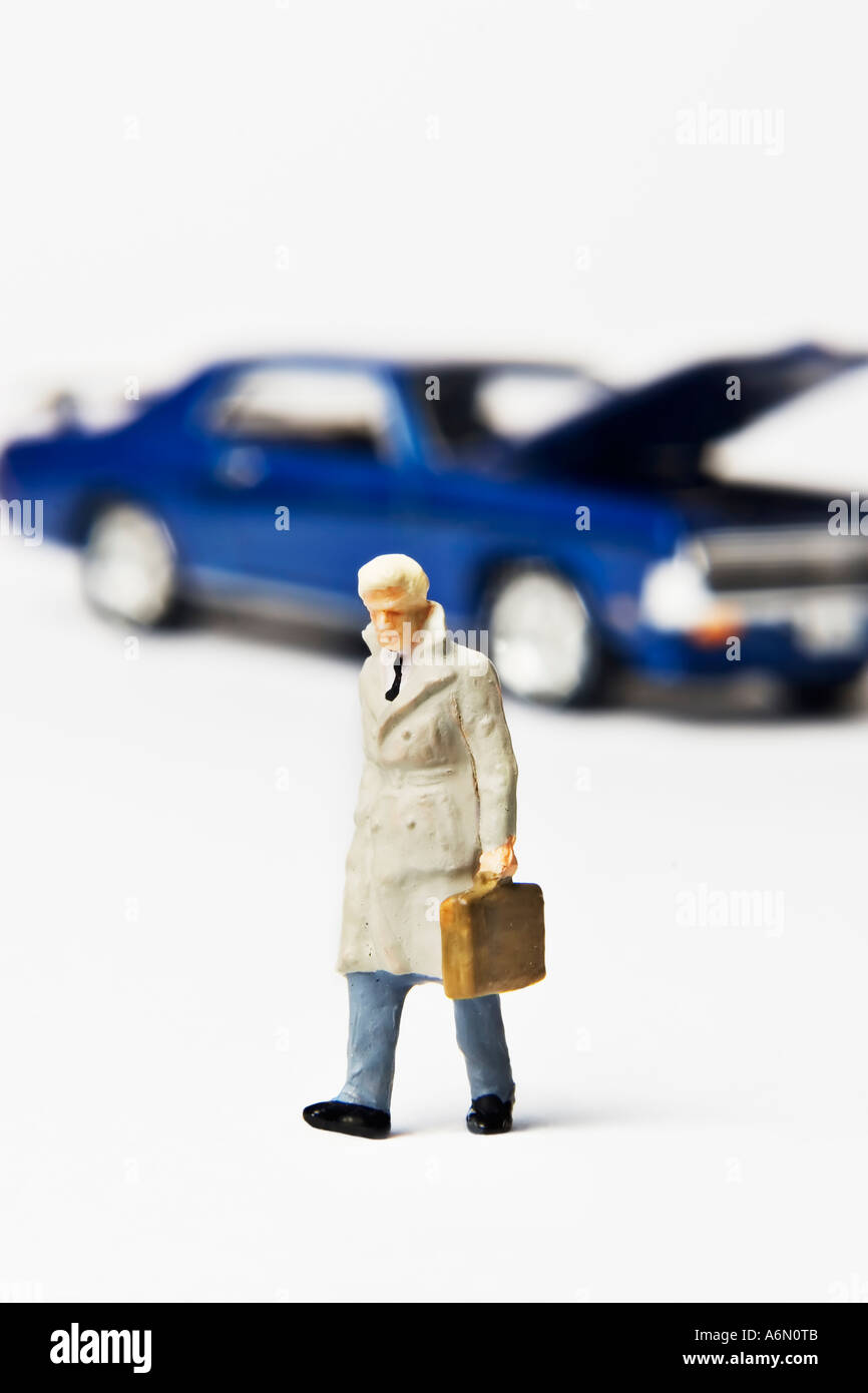 Business figure and toy car Stock Photo - Alamy