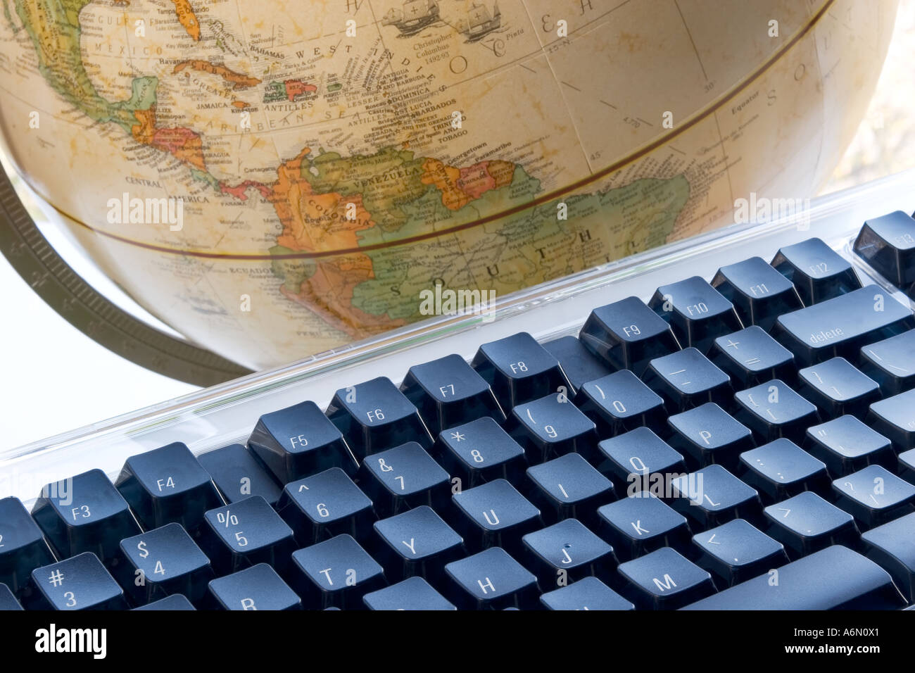 Earth globe and computer keyboard Stock Photo - Alamy