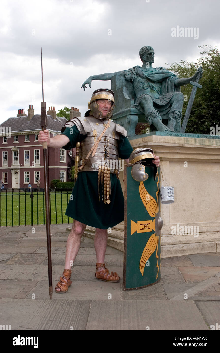 Roman Centurion standing next to a statue of Emperor Constantine Stock ...