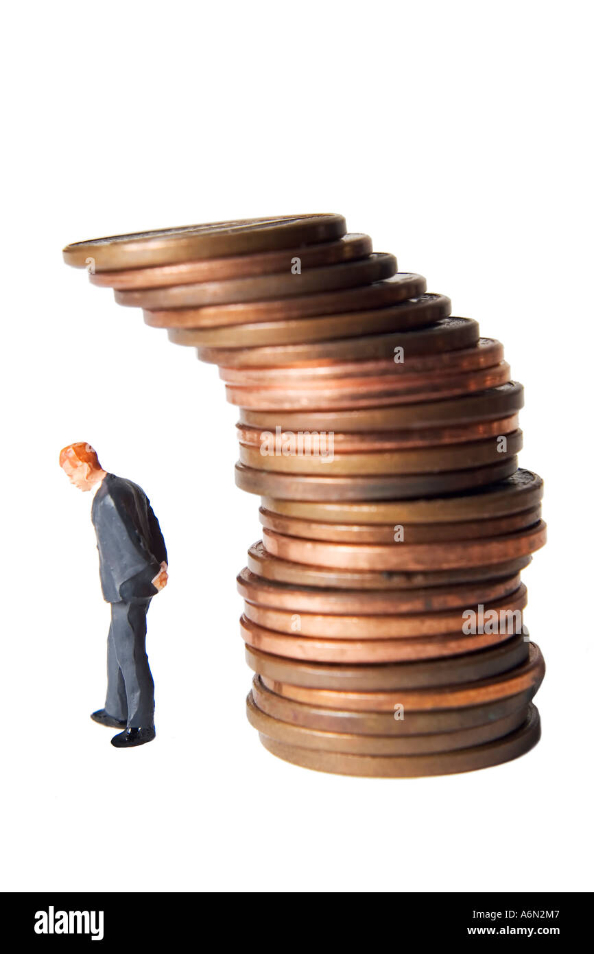 Business figure and a stack of pennies Stock Photo - Alamy