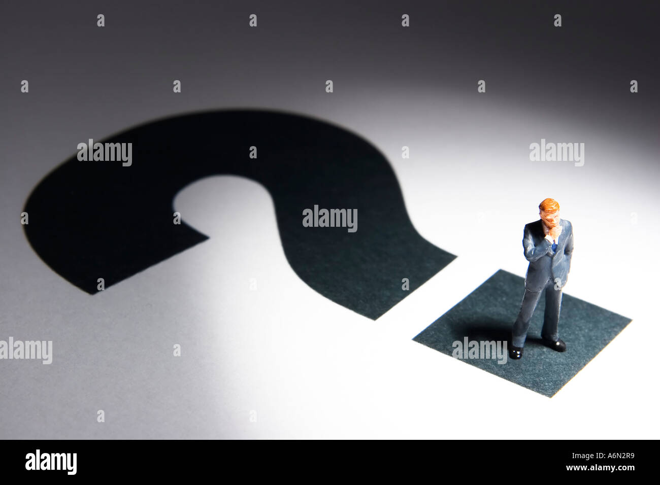 Business figurine and question mark Stock Photo - Alamy