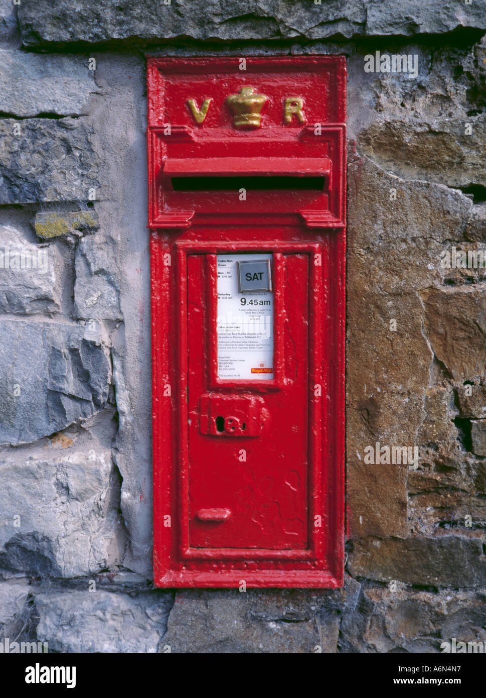 Red cast iron Victorian post box set in a wall, Selside, Ribblesdale ...
