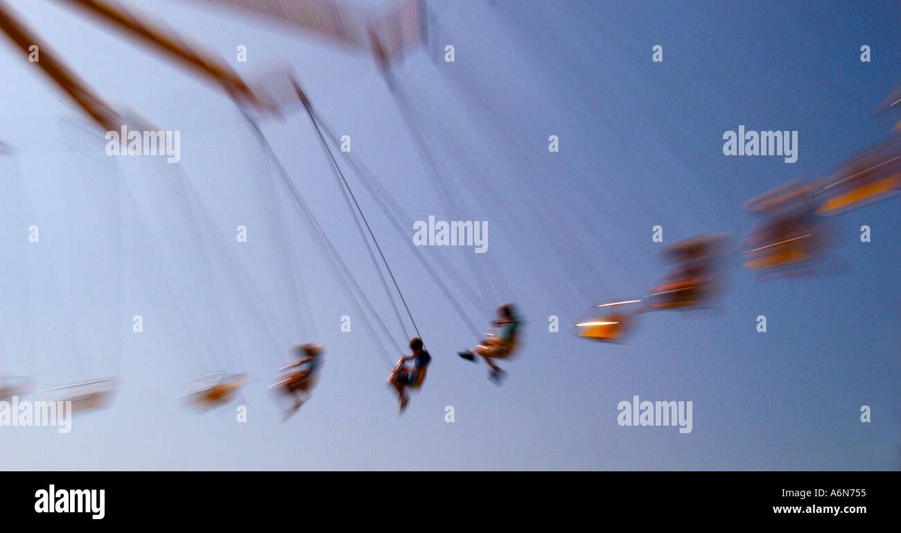 carnival swing ride Stock Photo - Alamy